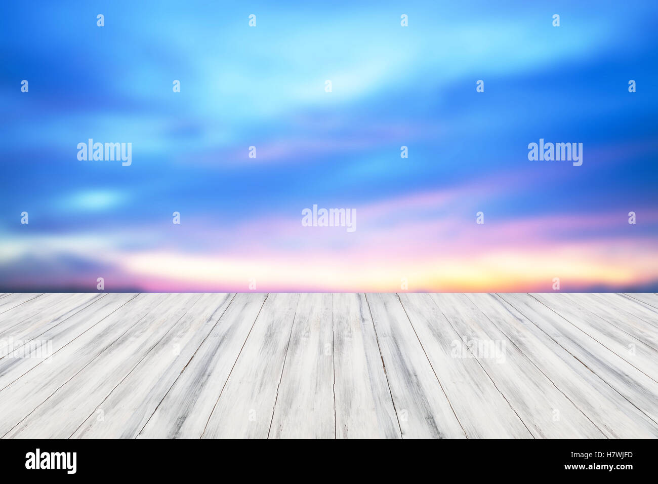 Empty white table top wooden with sunset background. For product ...