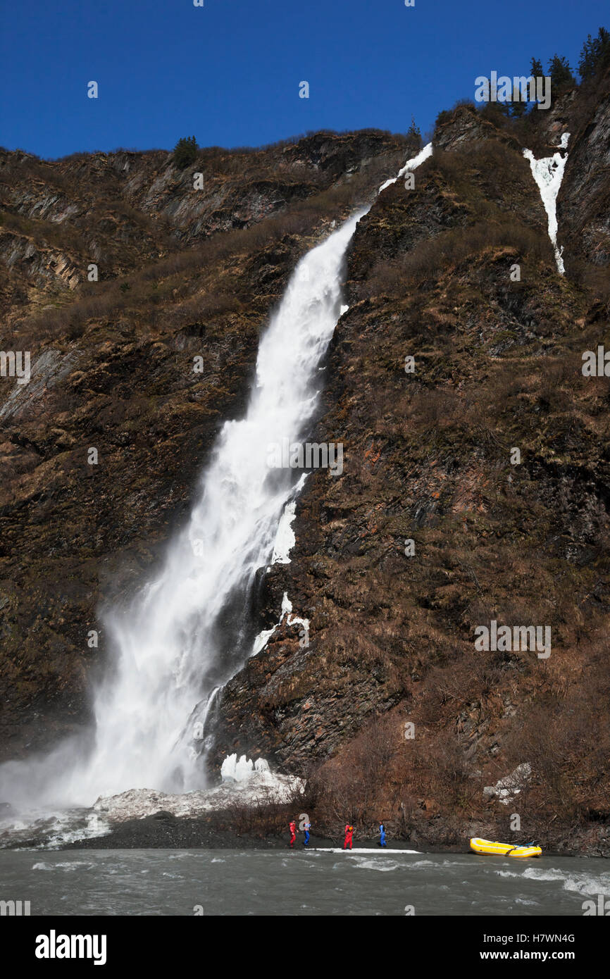 A raft stops at Bridal Veil Falls in Keystone Canyon near Valdez ...