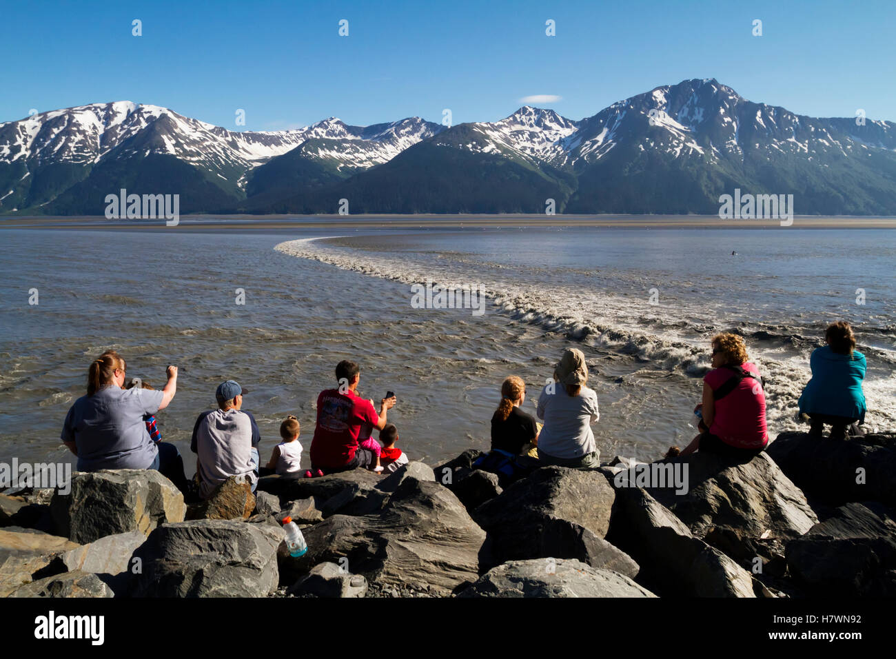 People watching the bore tide in Turnagain Arm at Mile 94 of the Seward ...