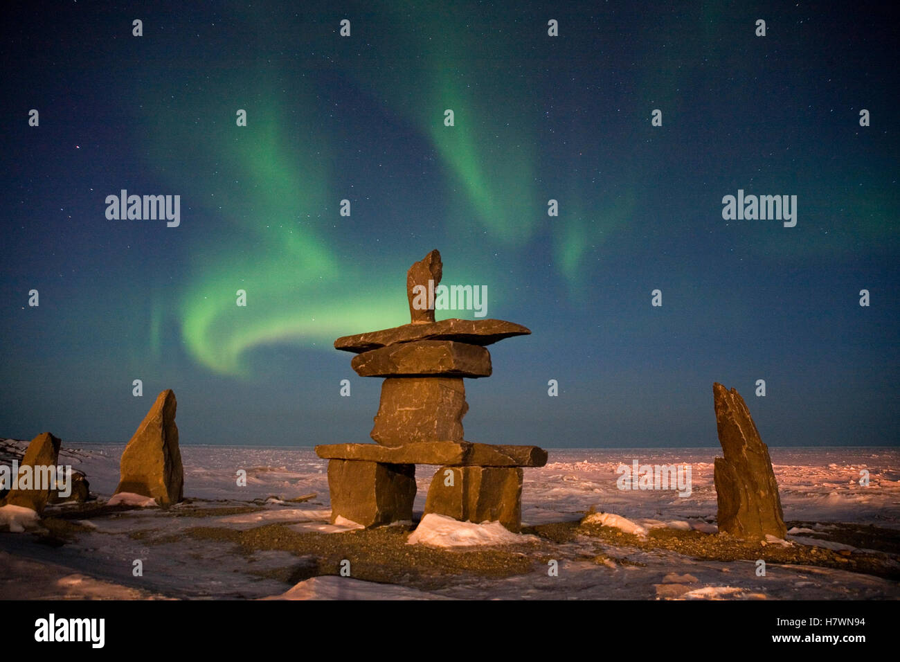 Aurora borealis over inukshuks, Churchill, Manitoba, Canada Stock Photo ...