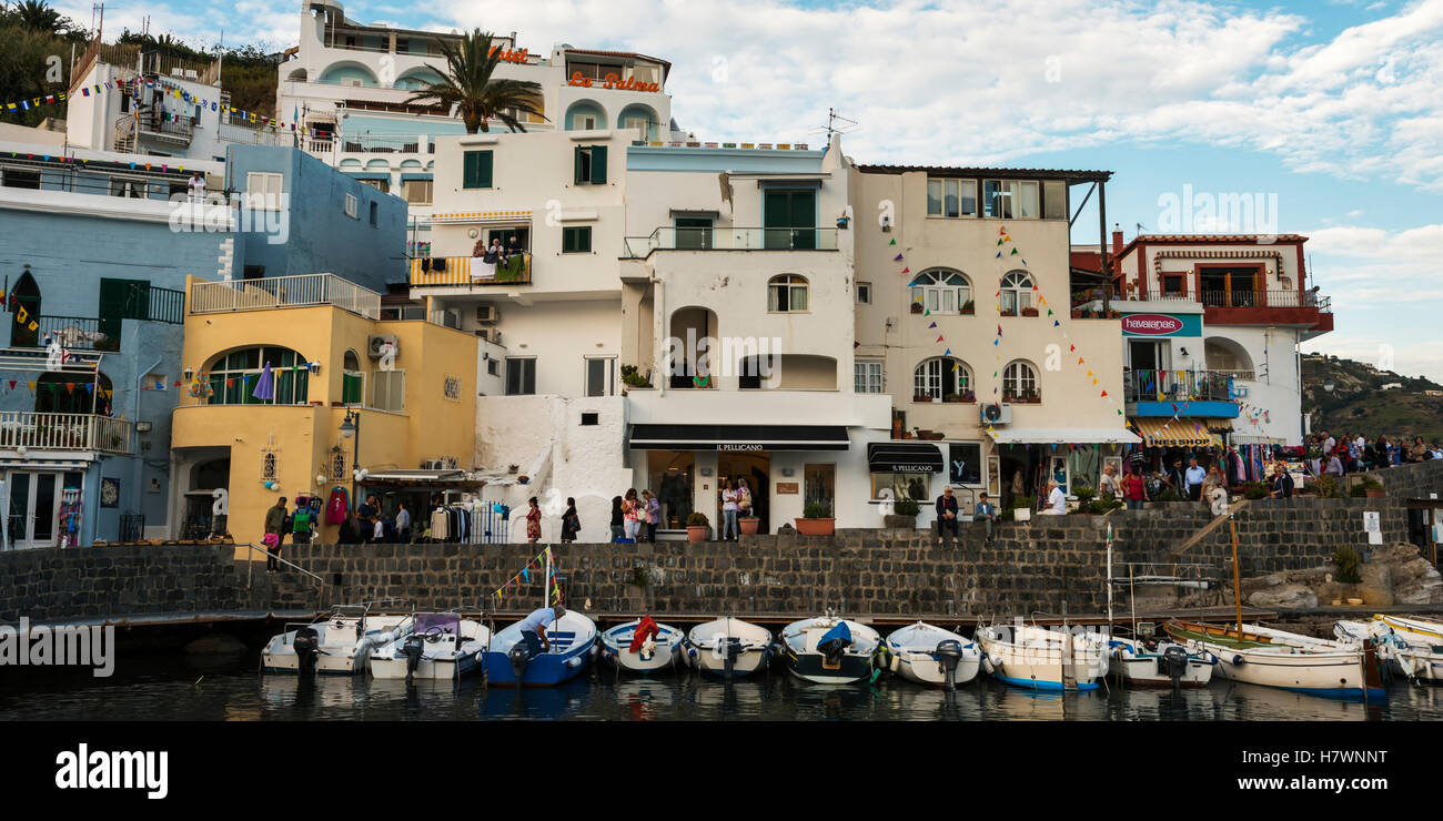 Pedestrians walking on the esplanade along the waterfront with ...