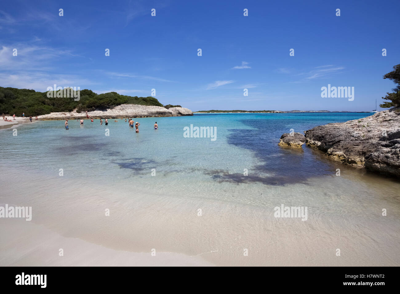 Calm white sand bay with turquoise clear water Stock Photo - Alamy