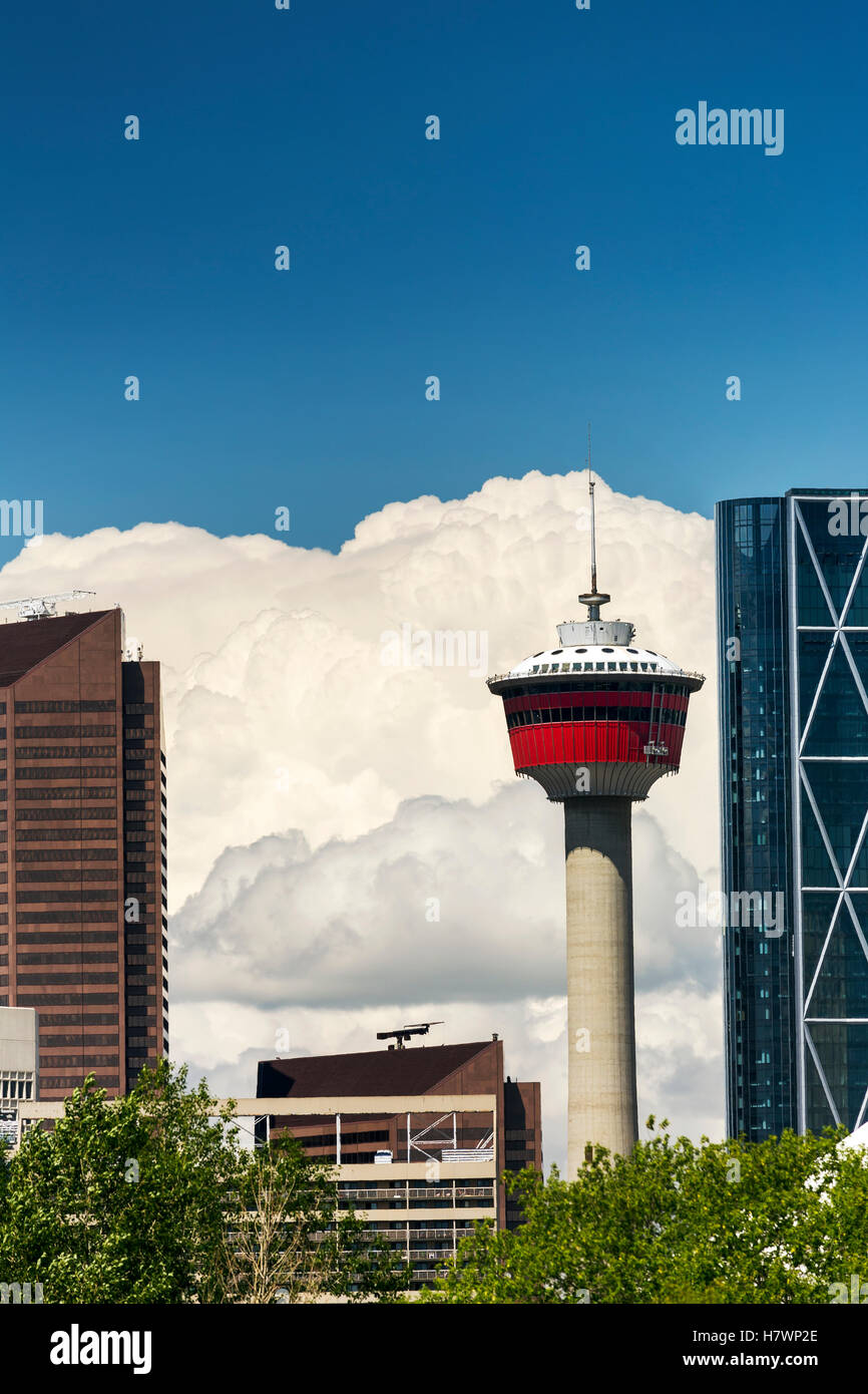 Large white thunderstorm clouds and blue sky with the Calgary Tower and ...