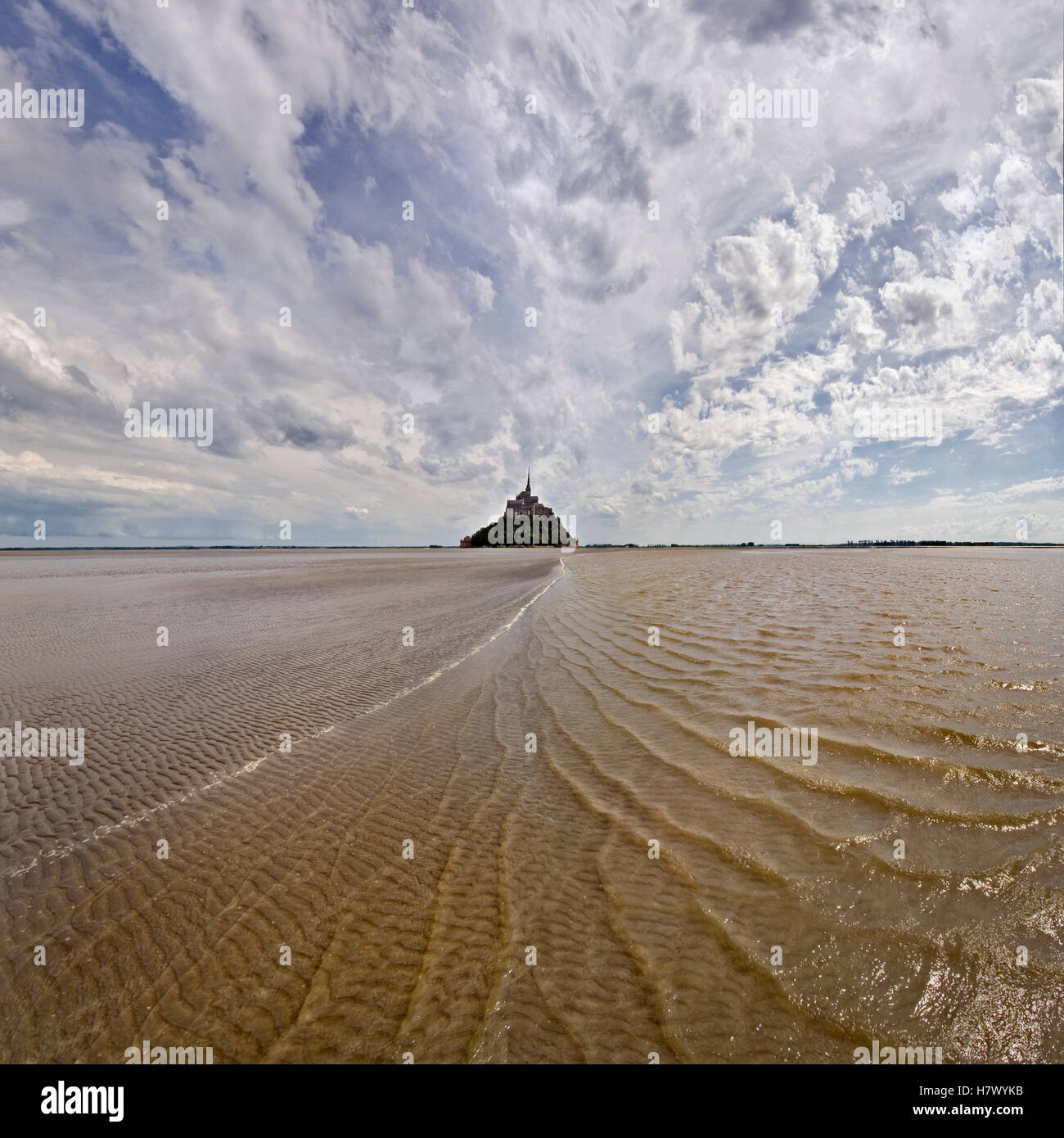 Mont Saint-Michel with waves in surrounding bay, Normandy, France Stock ...