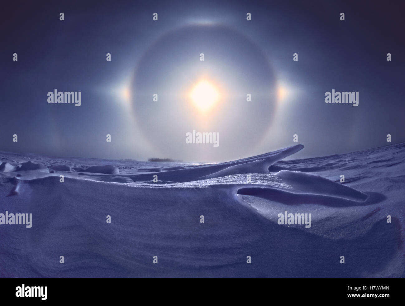 Sundogs, also known as mock sun, with snow field, Minnesota Stock Photo ...