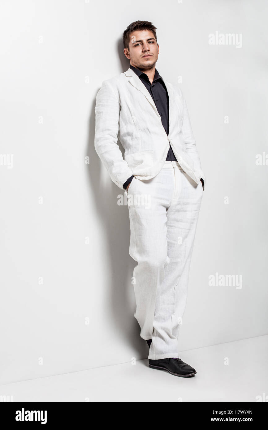 young man wearing white suit Stock Photo - Alamy