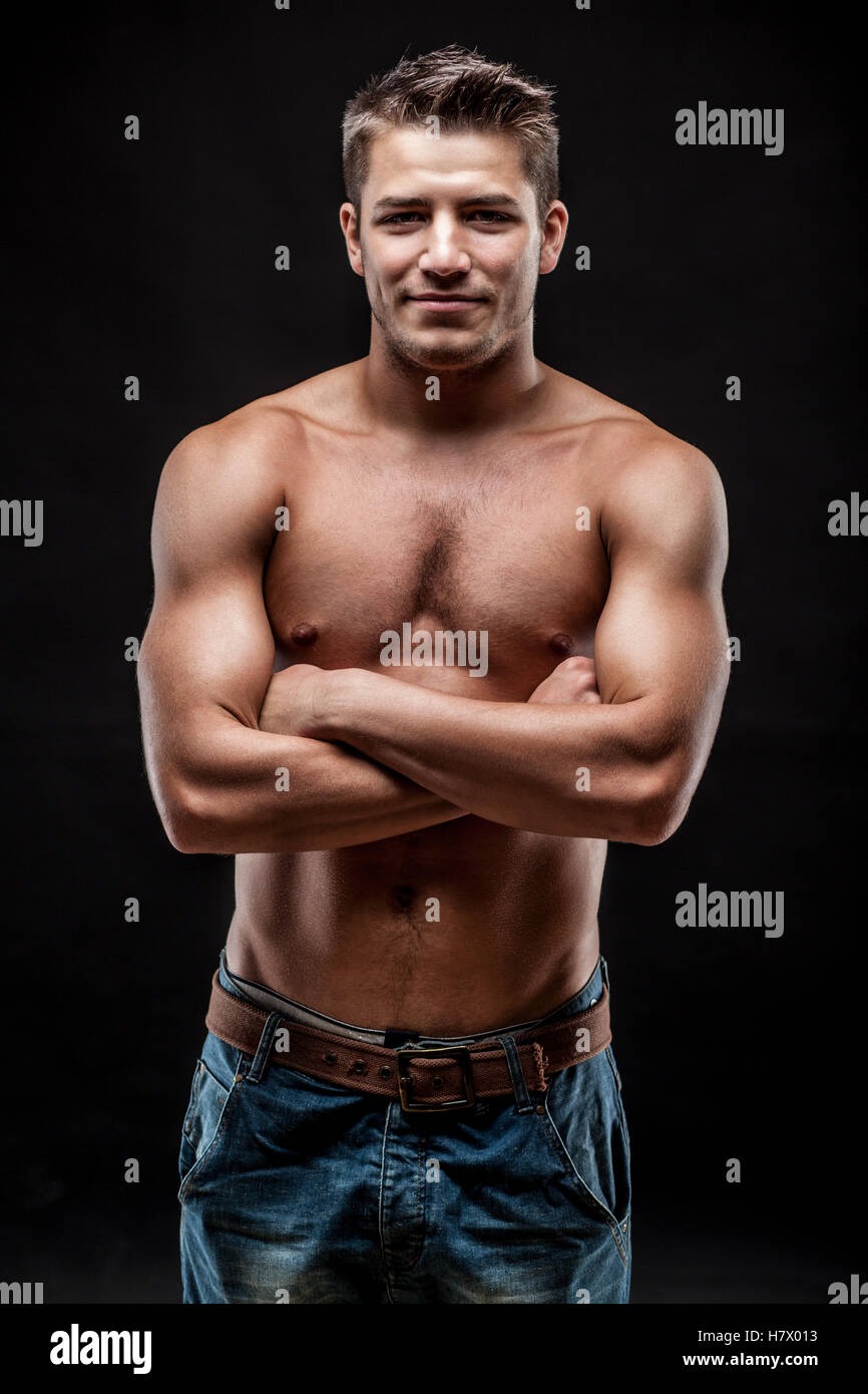 young man on dark background Stock Photo - Alamy