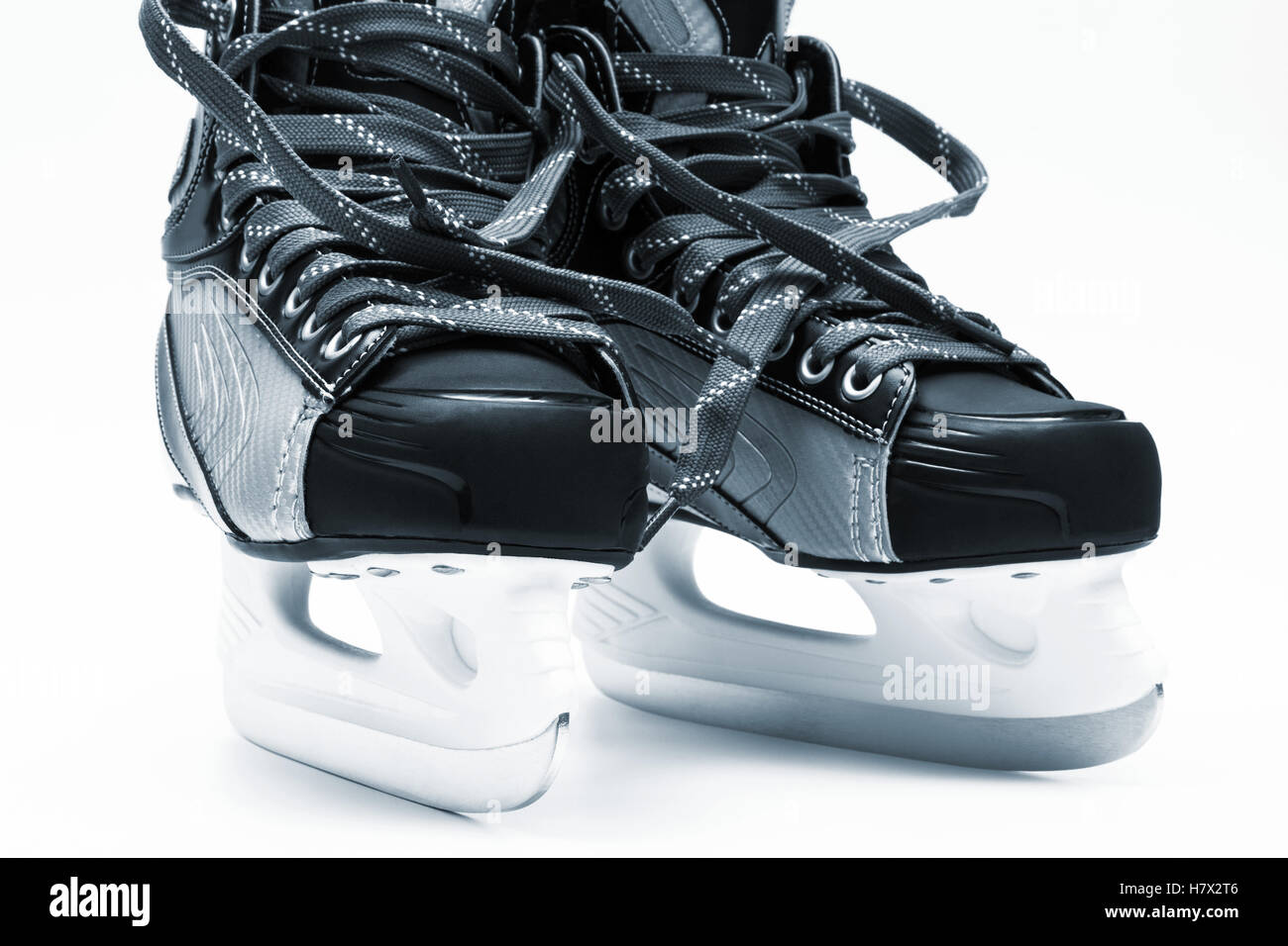 new and modern black skates on white background Stock Photo - Alamy