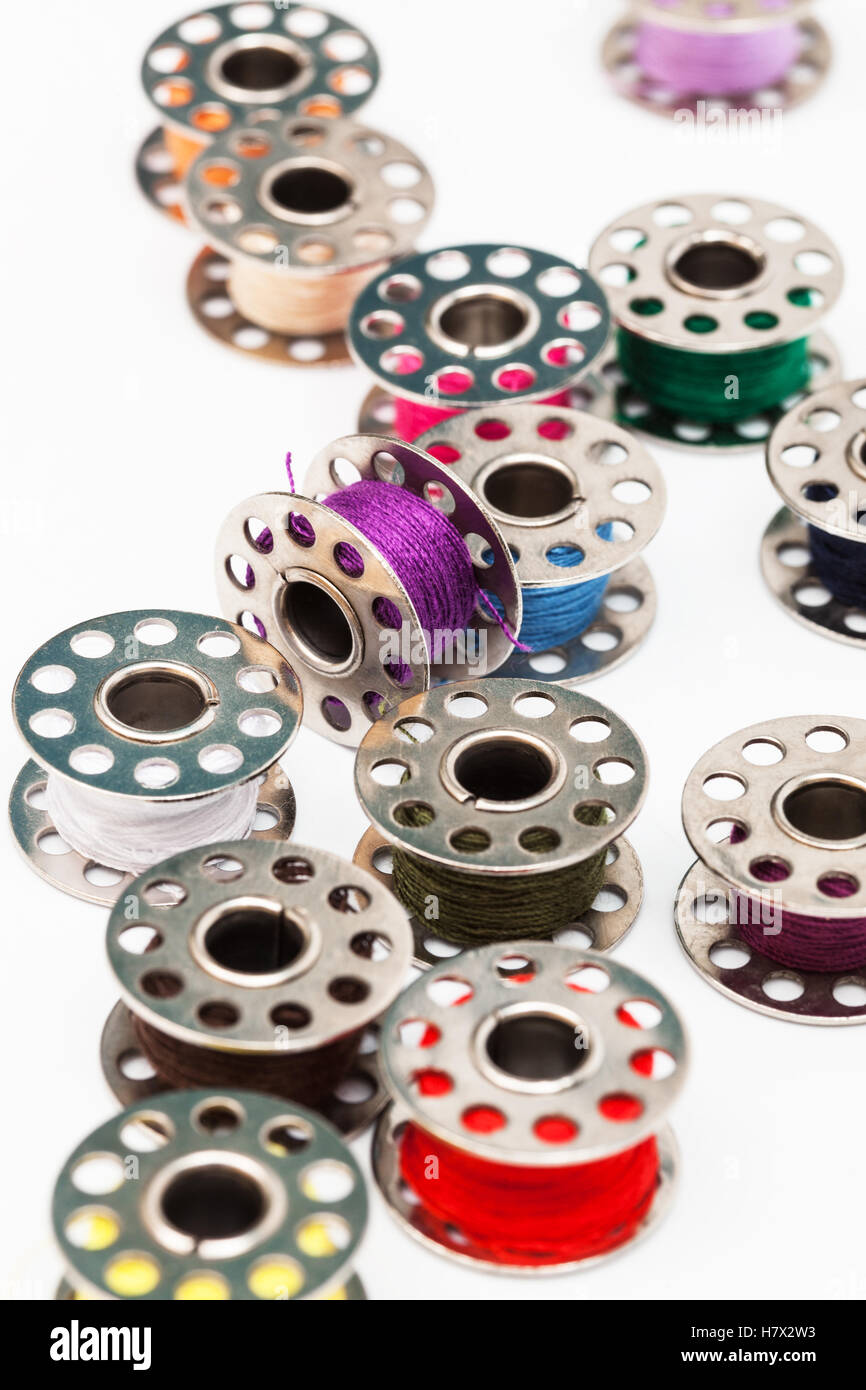 spools of thread on a white background Stock Photo - Alamy