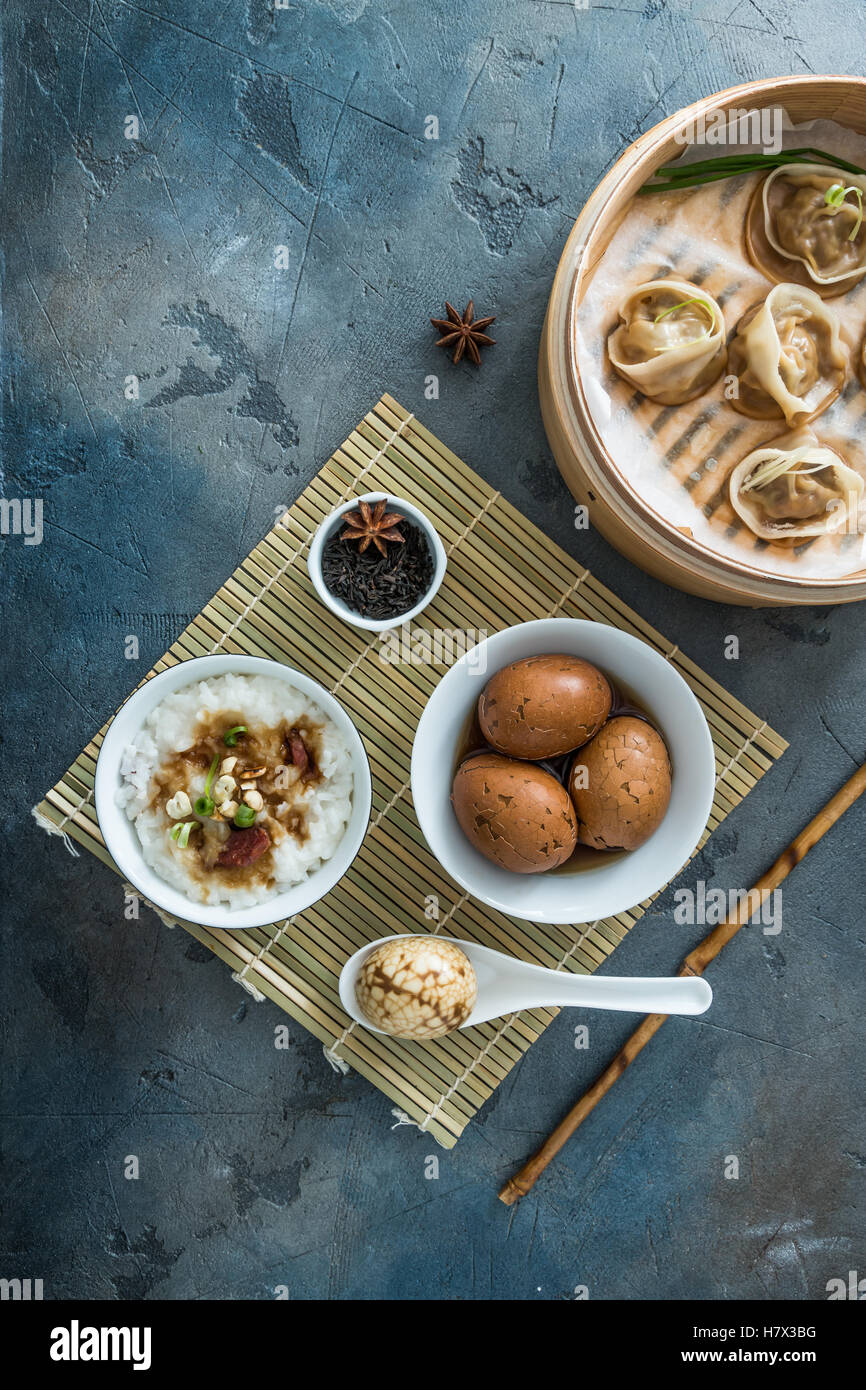 Chinese Streamed Dumpling with tea eggs and porrige Stock Photo - Alamy