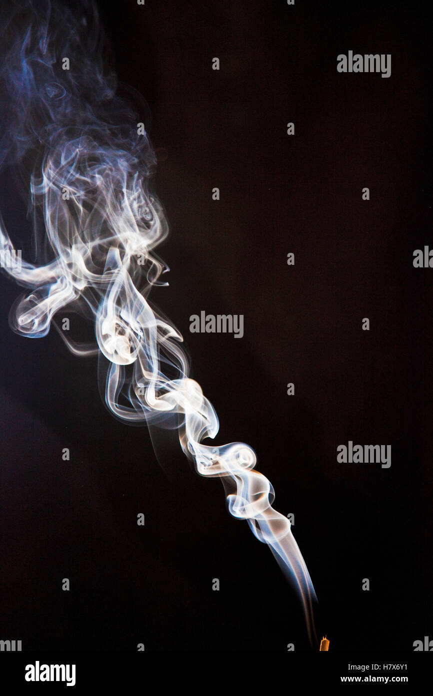 Incense smoke rising, New Zealand Stock Photo - Alamy