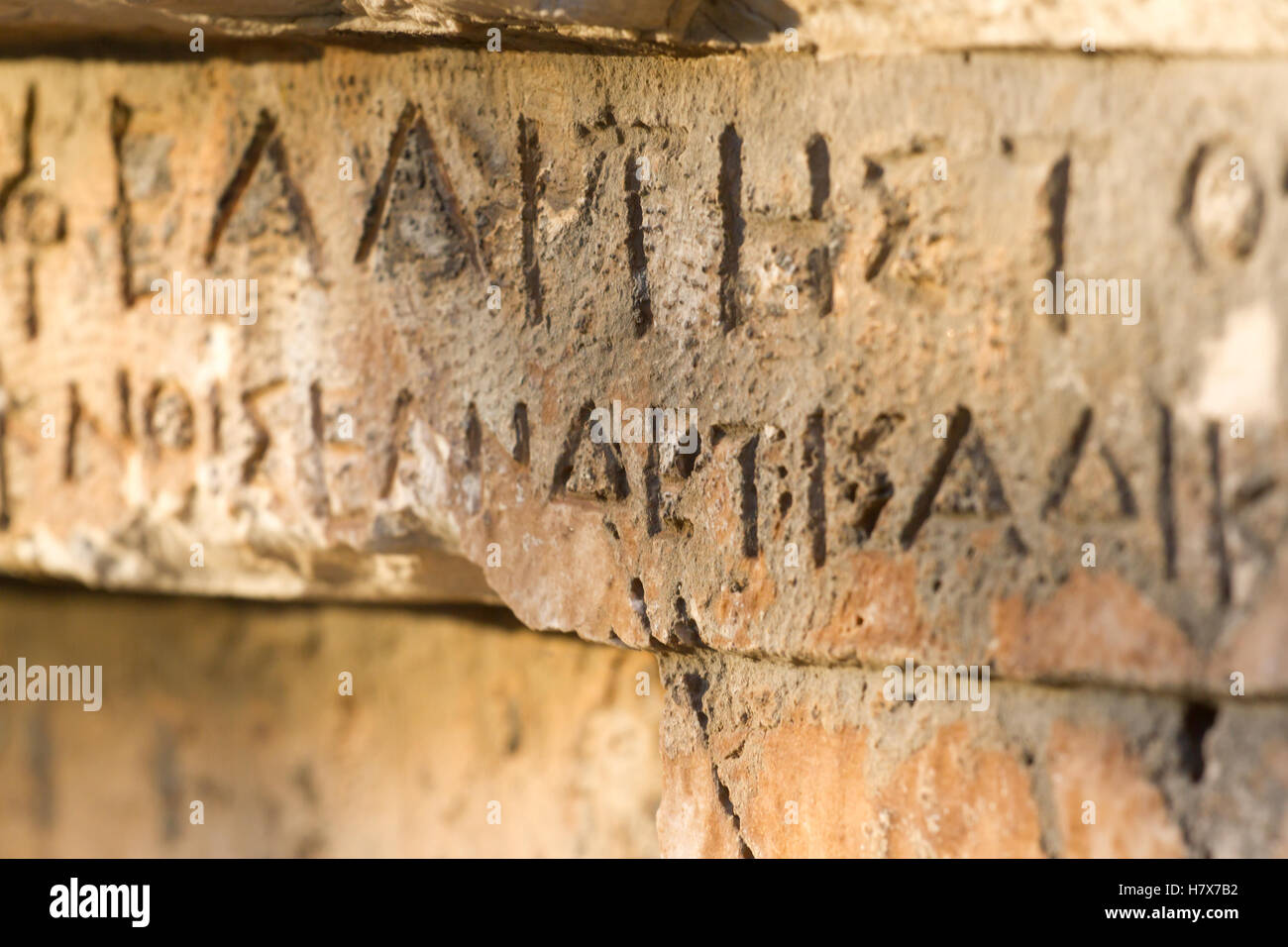 Inscription on old tomb in the Greek language. Characters, symbols ...