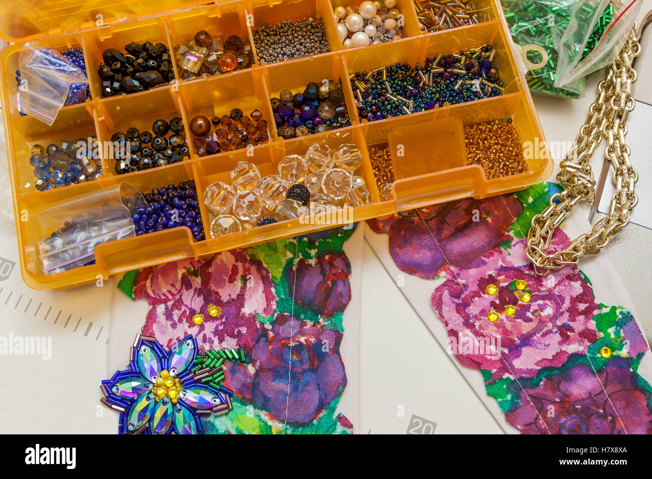 Beadwork. Yellow box with the different colored beads for beadwork ...