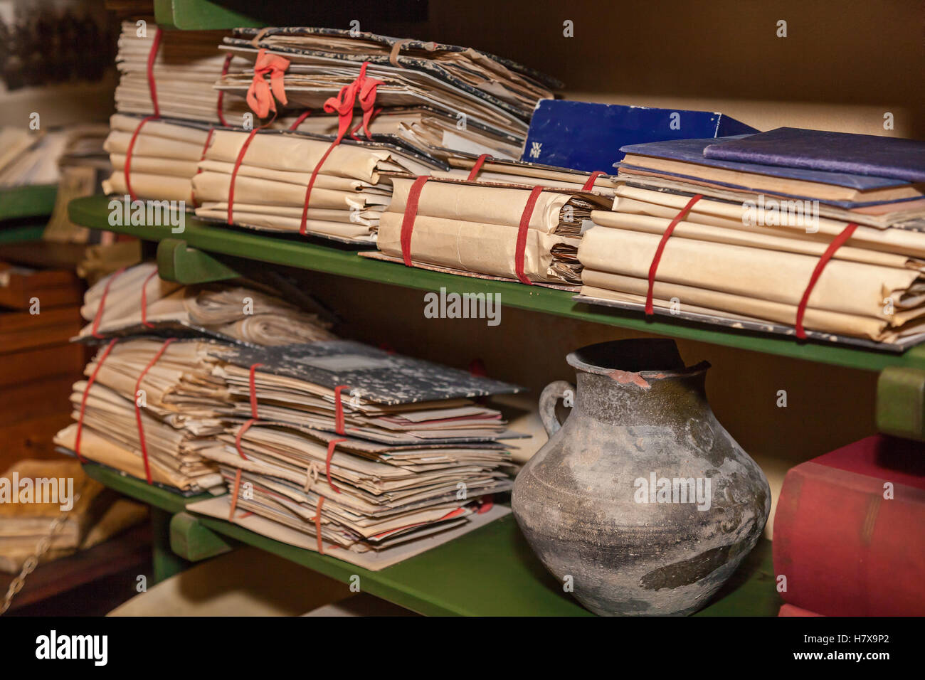 Volumes of documents. Volumes of document cases tied with red ribbons ...