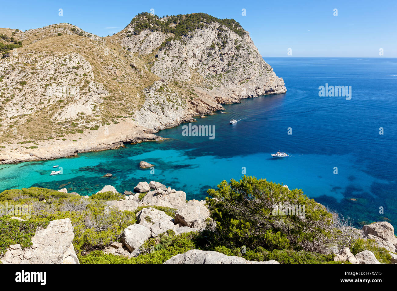 Azure bay, azure bay with crystal clear waters, towering above the bay ...