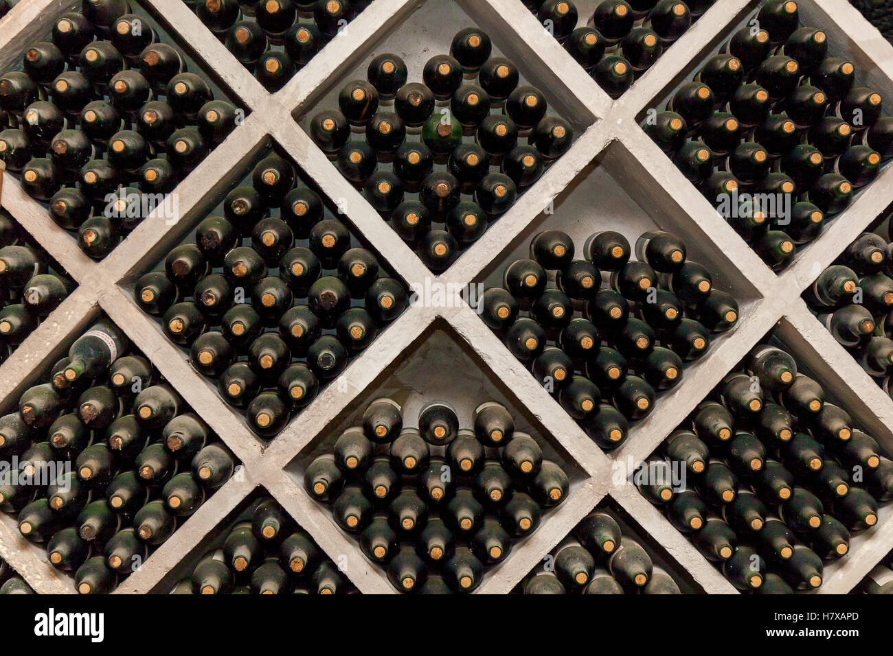 Many dusty wine bottles are on the shelves,Racks of wine bottles Stock ...