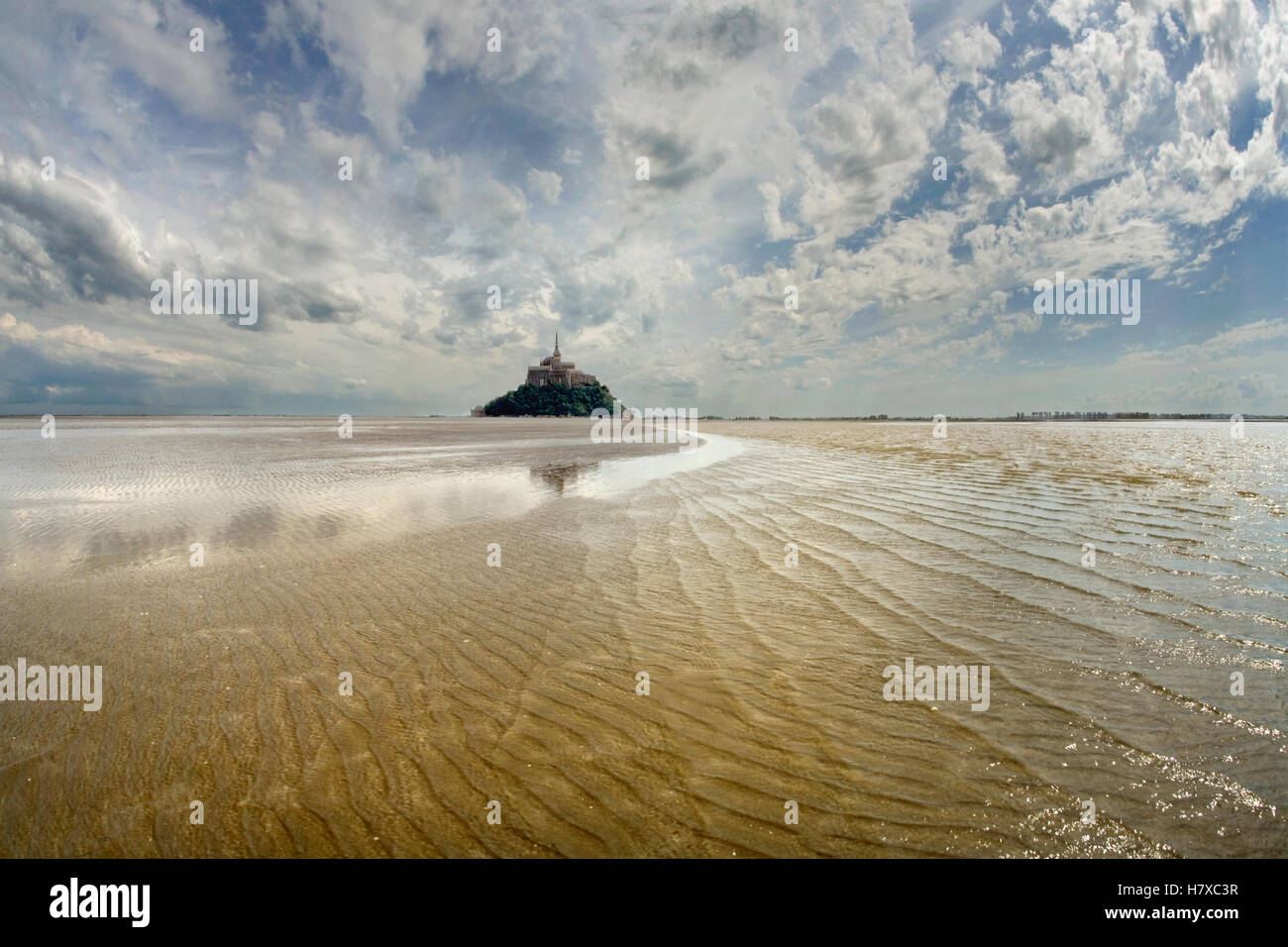 Mont Saint-Michel with waves in surrounding bay, Normandy, France Stock ...