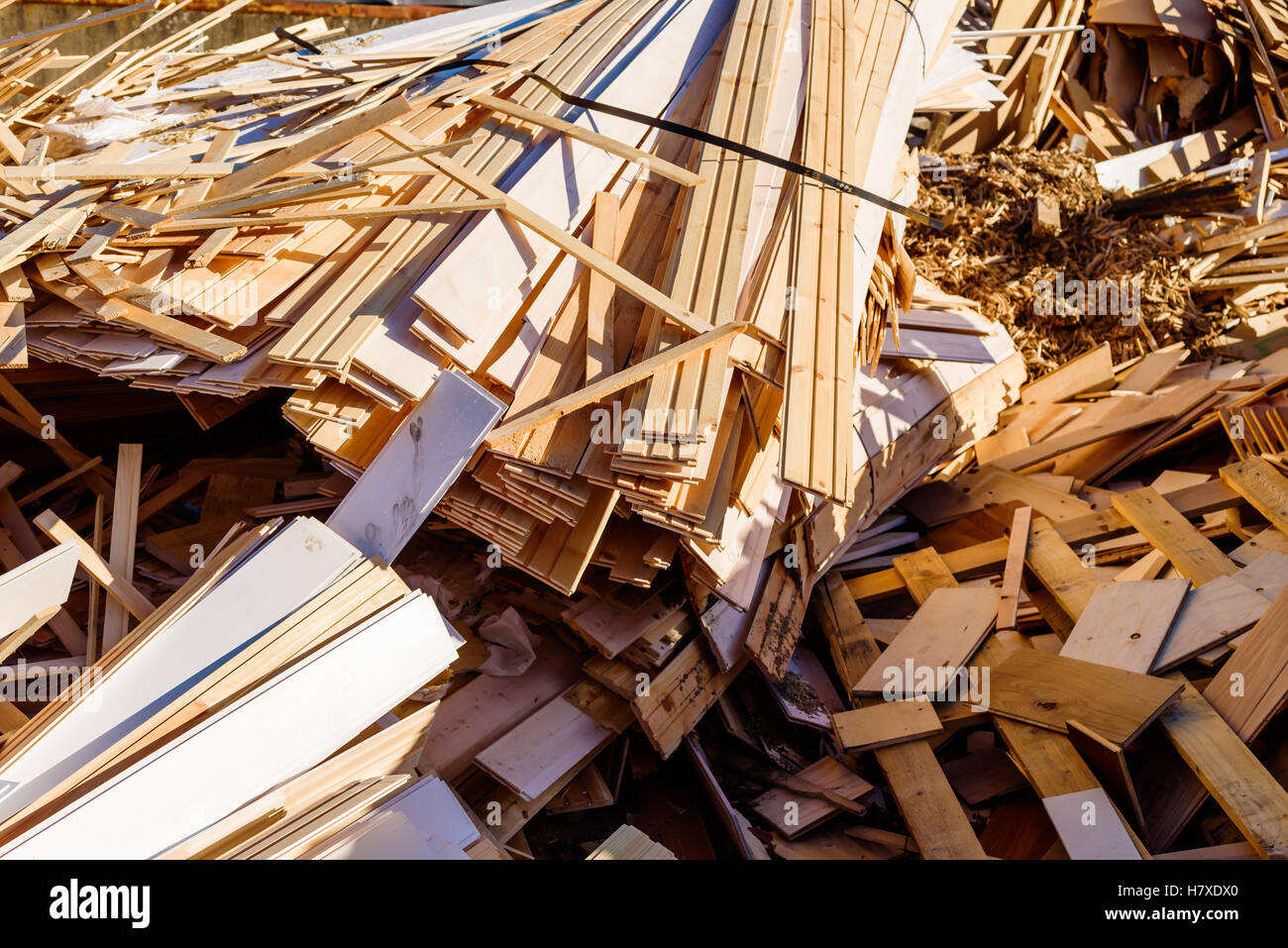 Pile of wooden debris in industrial area. The wood is later shredded to ...