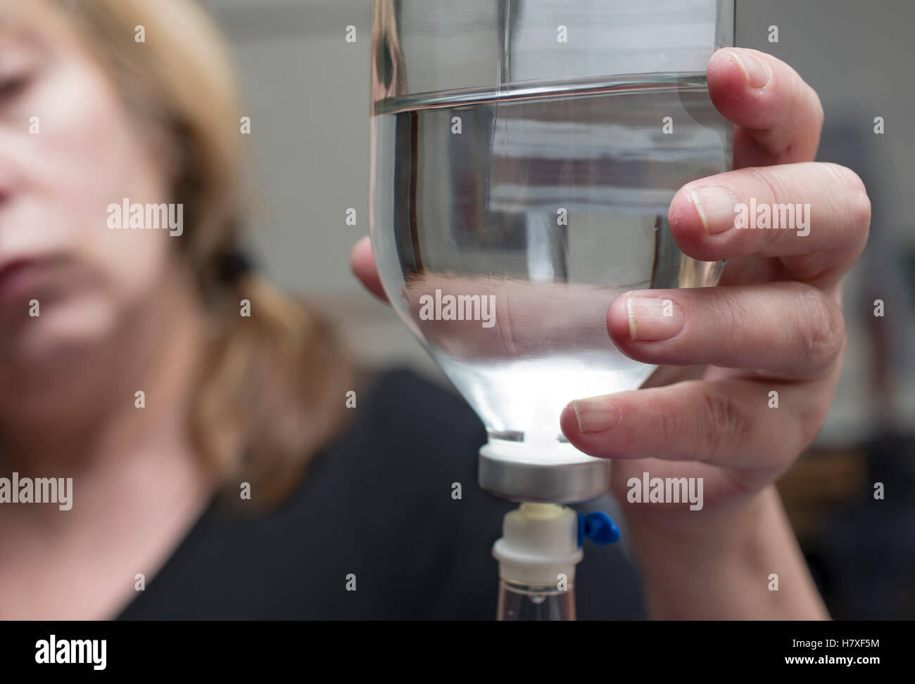 Doctor giving infusion hi-res stock photography and images - Alamy