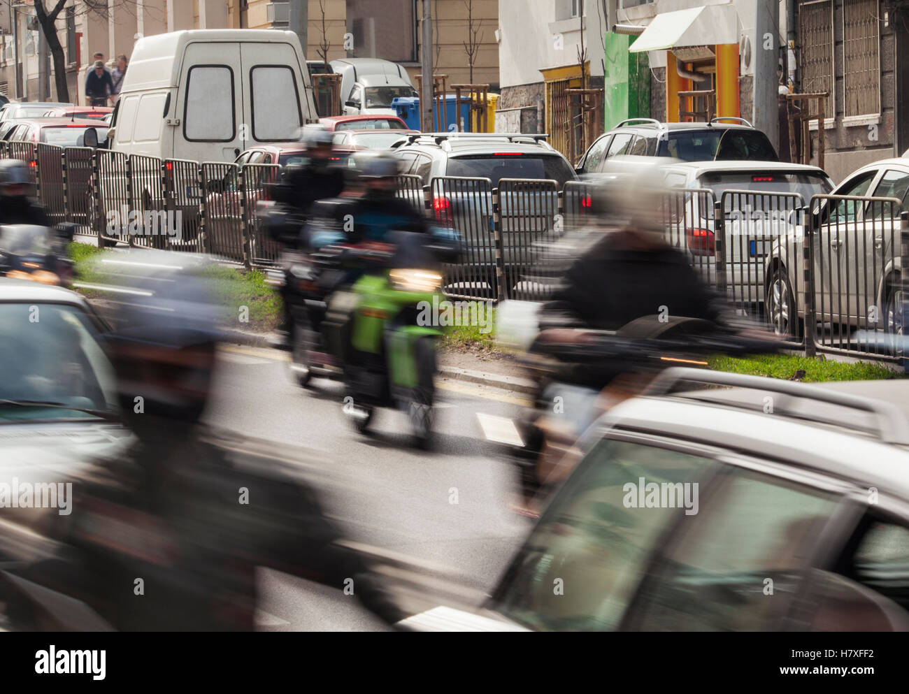 Heavy traffic on a street of a big town with cars and blurred ...