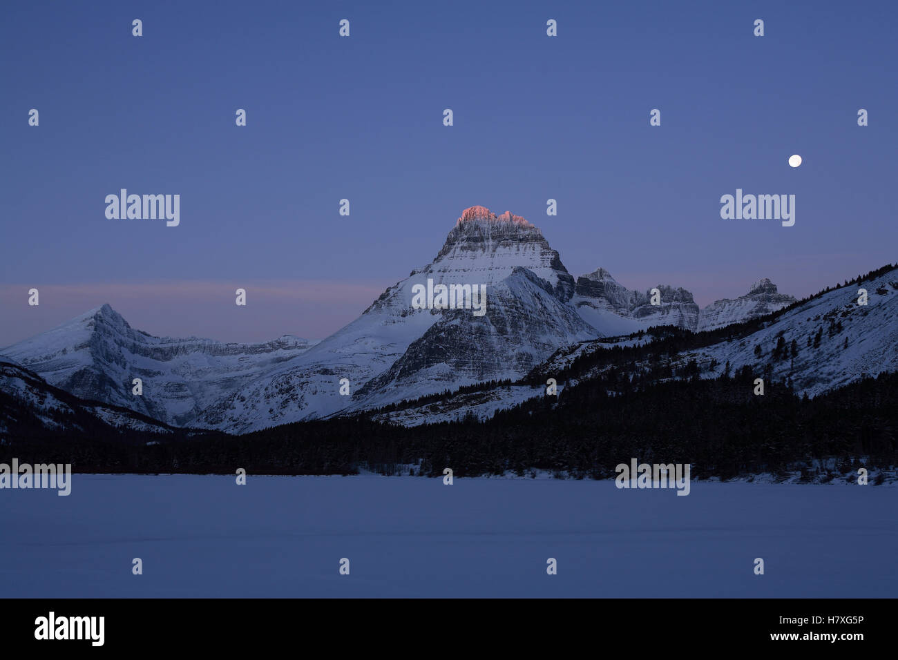 Mount Wilbur and full moon, Glacier National Park, Montana Stock Photo ...