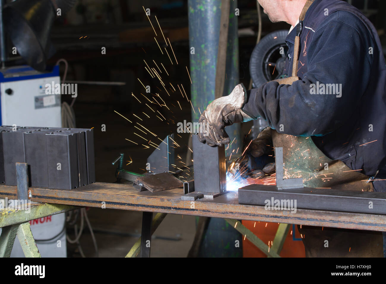 metalworker at work in his workshop Stock Photo - Alamy