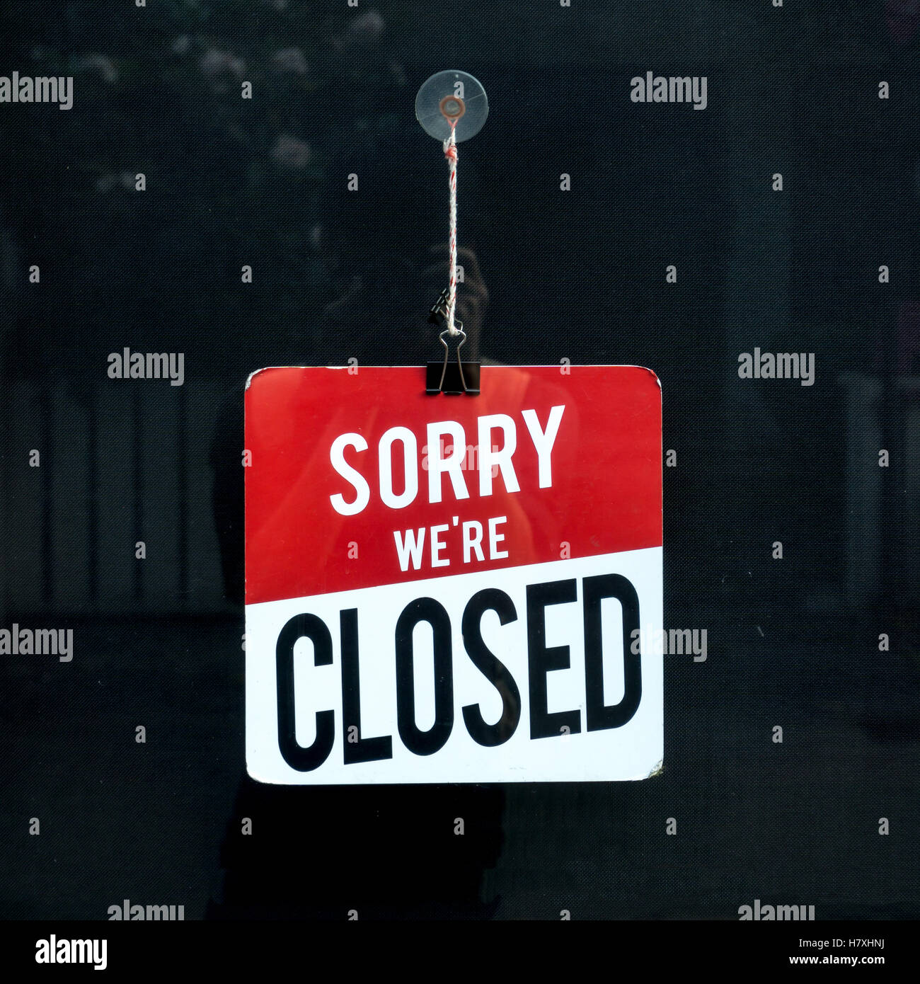 Closed sign in a shop window sorry we are closed Stock Photo - Alamy