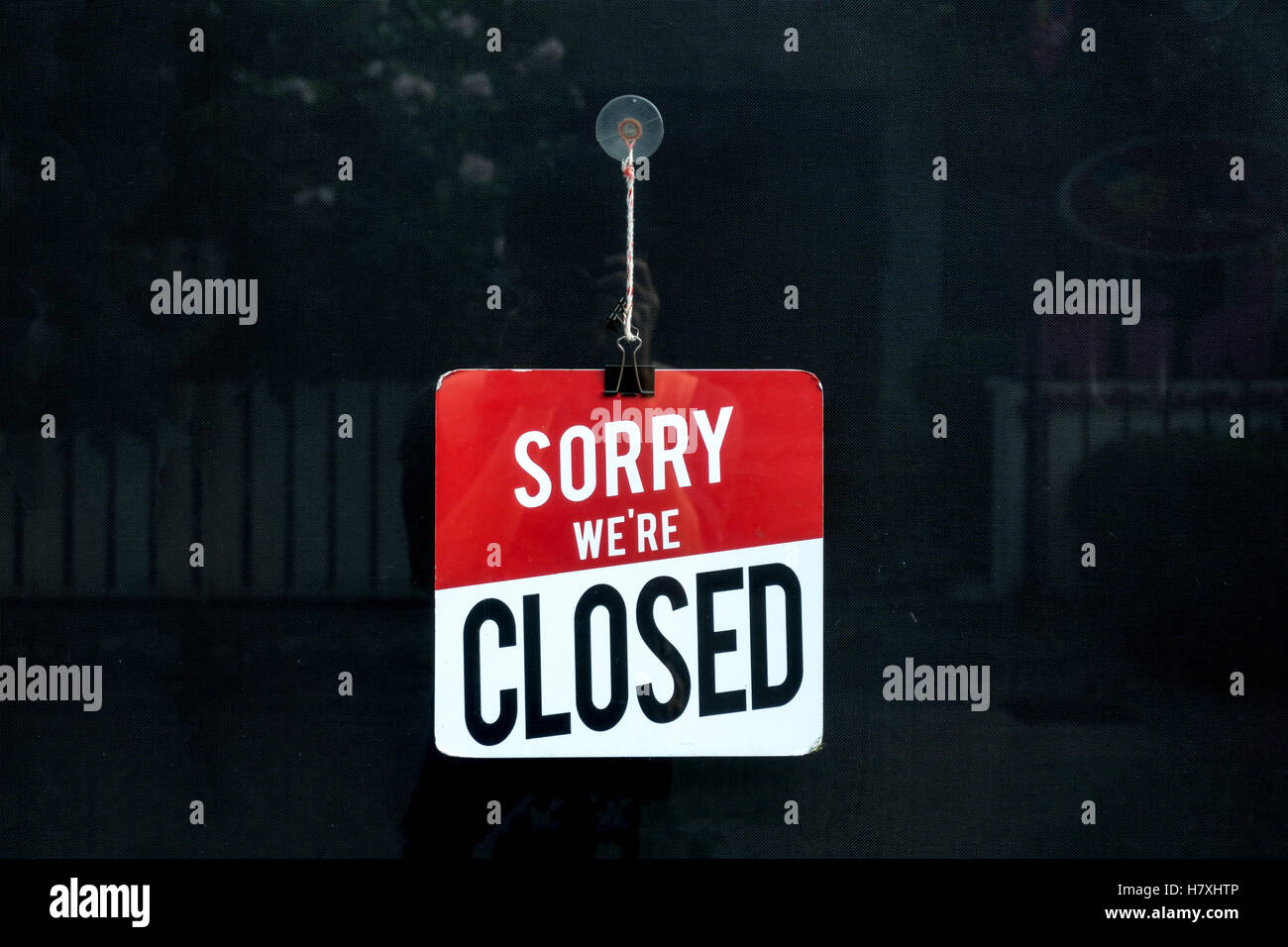 Closed sign in a shop window sorry we are closed Stock Photo - Alamy