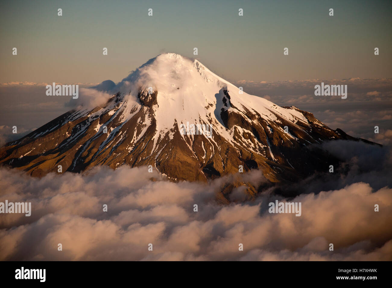 Mount Taranaki showing western flanks of dormant volcano above clouds ...
