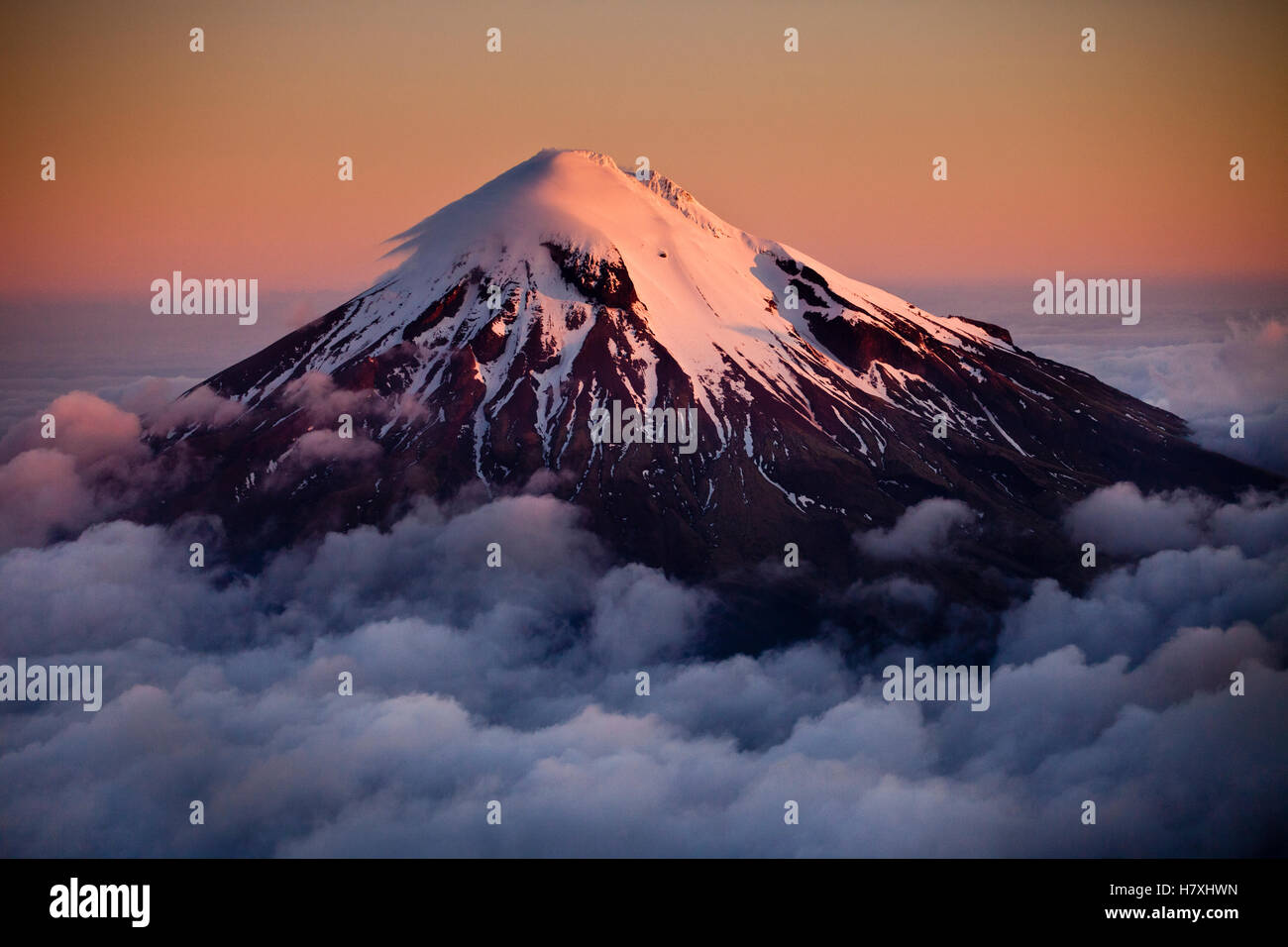 Mount Taranaki showing western flanks of dormant volcano above clouds ...