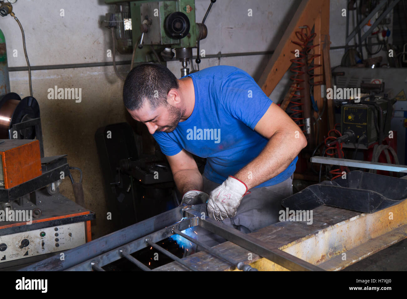 metalworker at work in his workshop Stock Photo - Alamy
