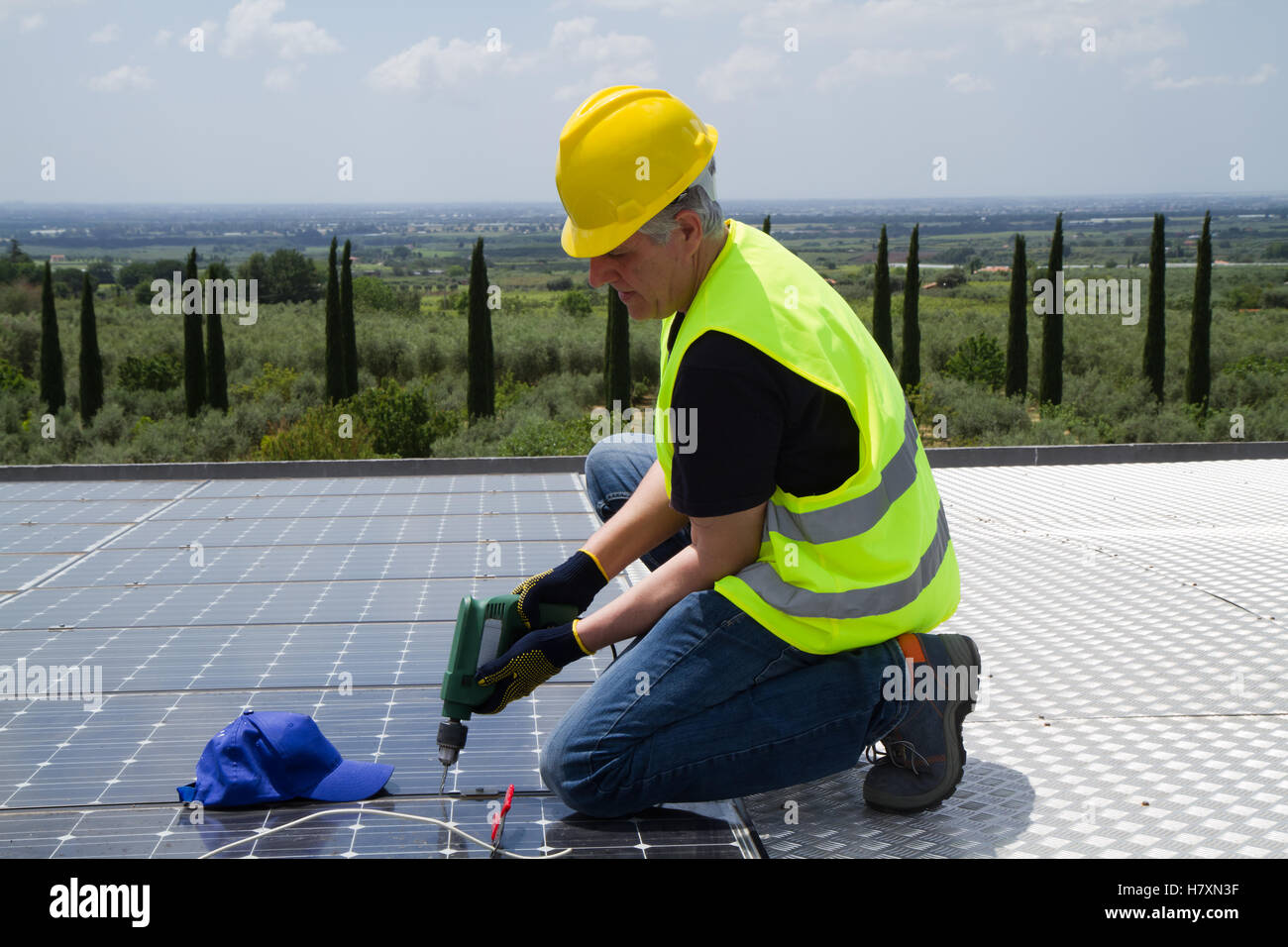 skilled worker working on a photovoltaic plant Stock Photo - Alamy