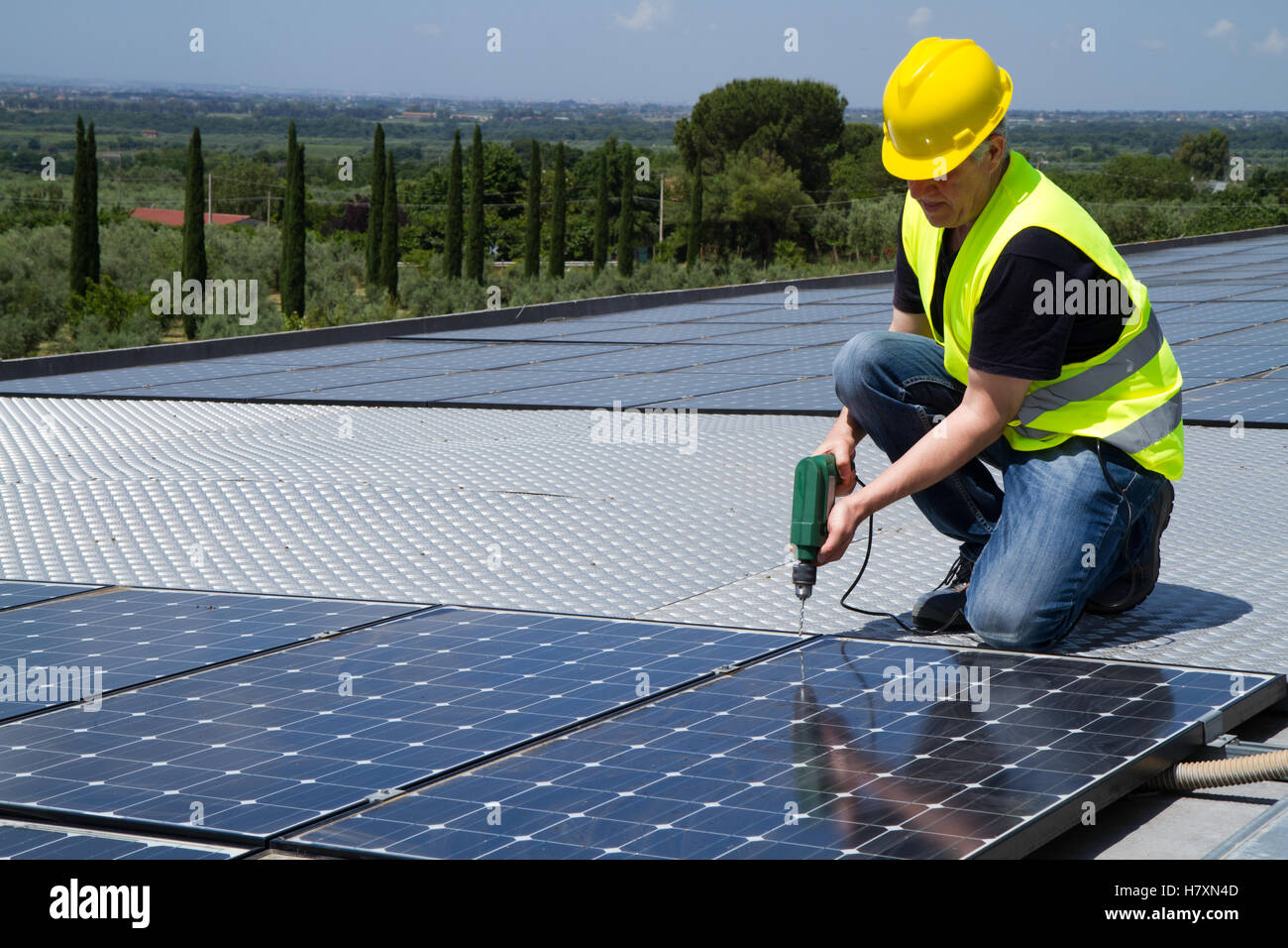 skilled worker working on a photovoltaic plant Stock Photo - Alamy