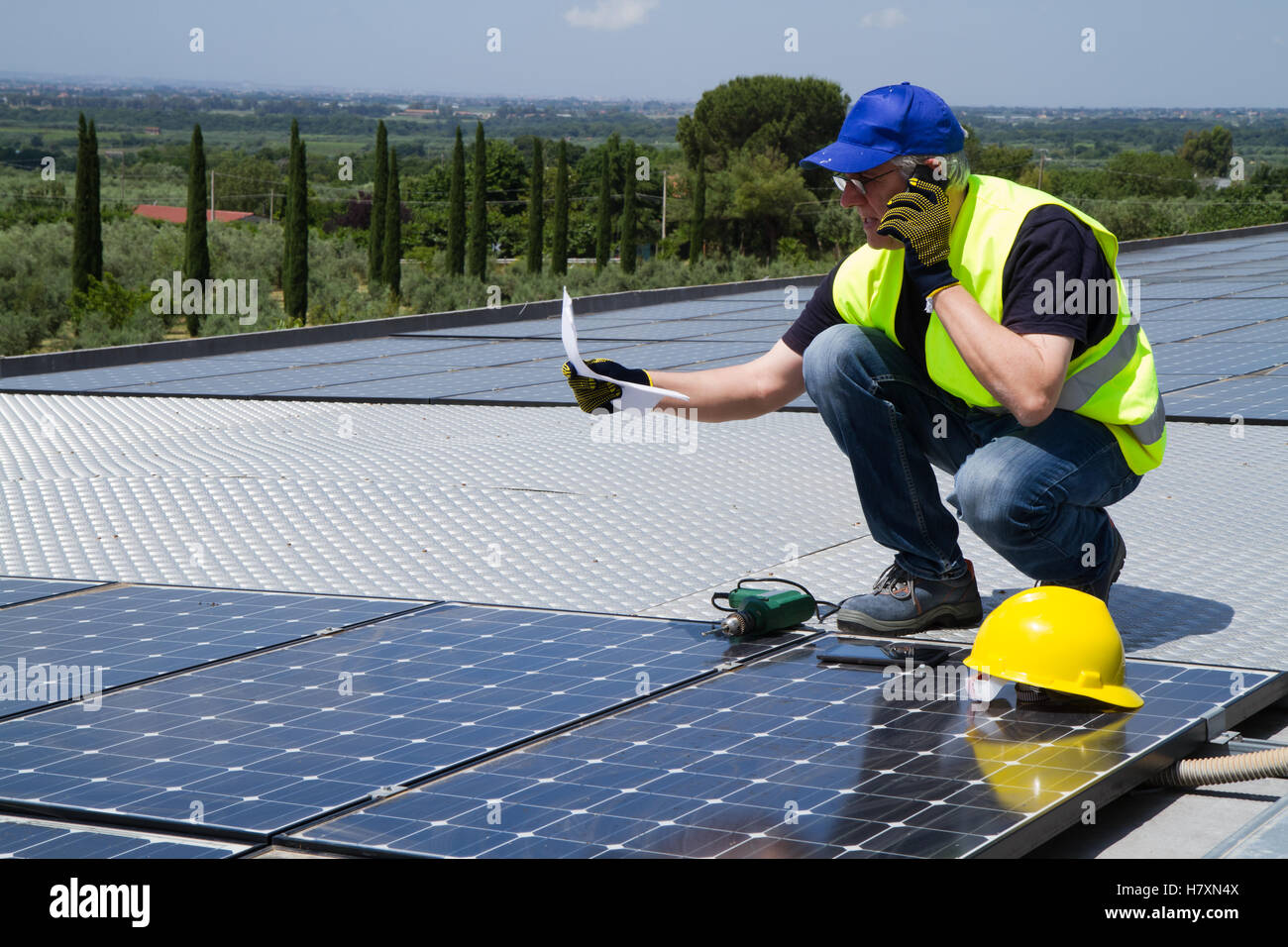 skilled worker working on a photovoltaic plant Stock Photo - Alamy