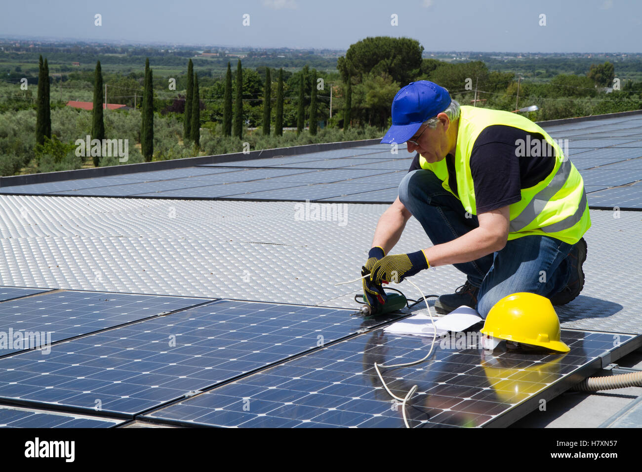 skilled worker working on a photovoltaic plant Stock Photo - Alamy