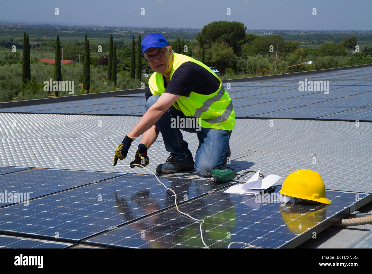 skilled worker working on a photovoltaic plant Stock Photo - Alamy