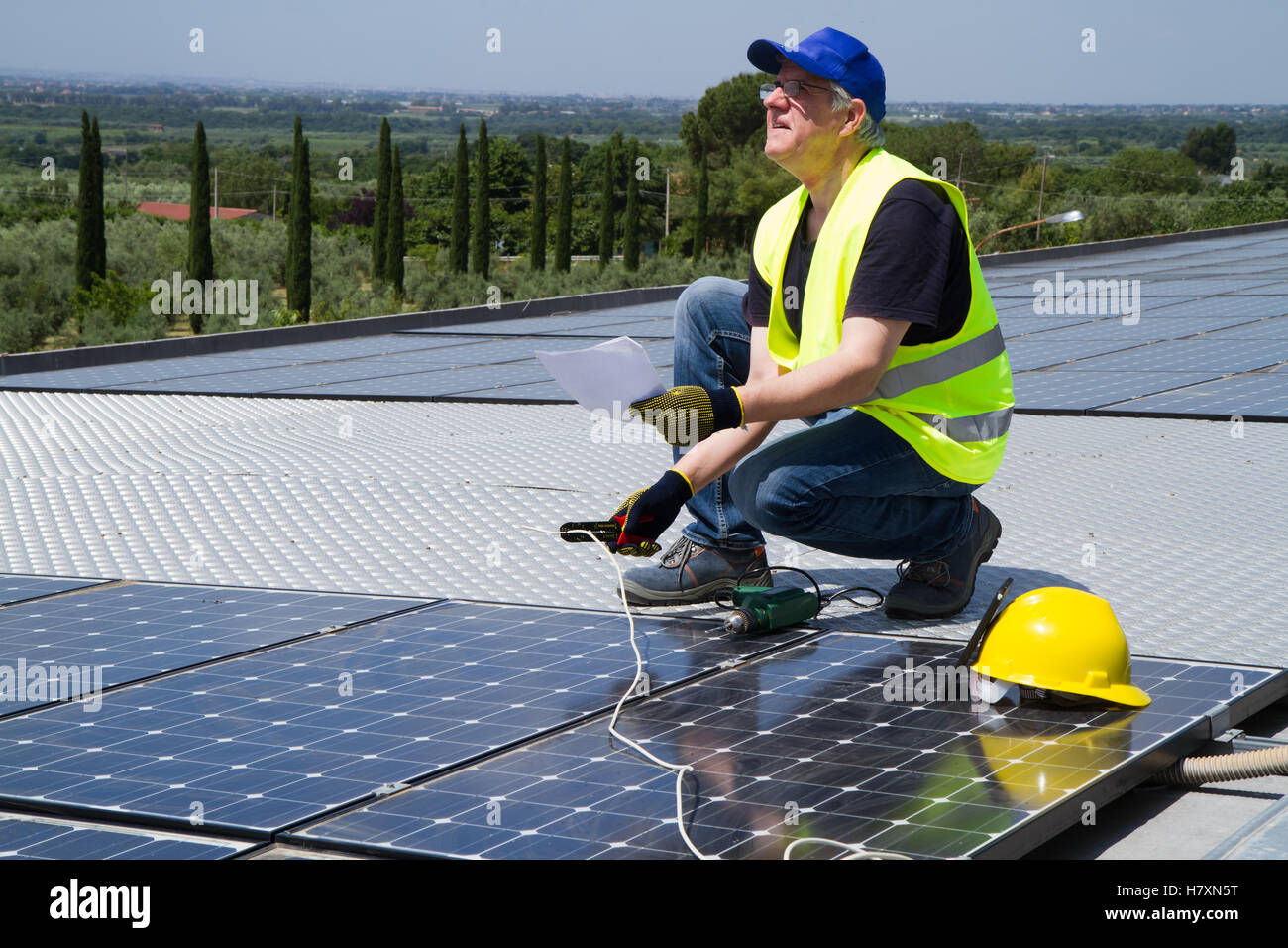 skilled worker working on a photovoltaic plant Stock Photo - Alamy