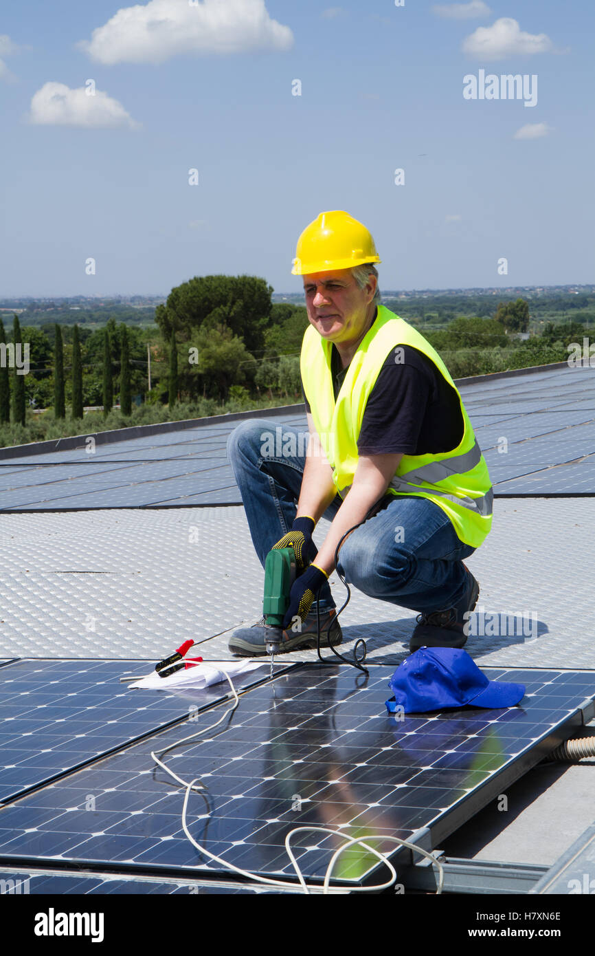 skilled worker working on a photovoltaic plant Stock Photo - Alamy