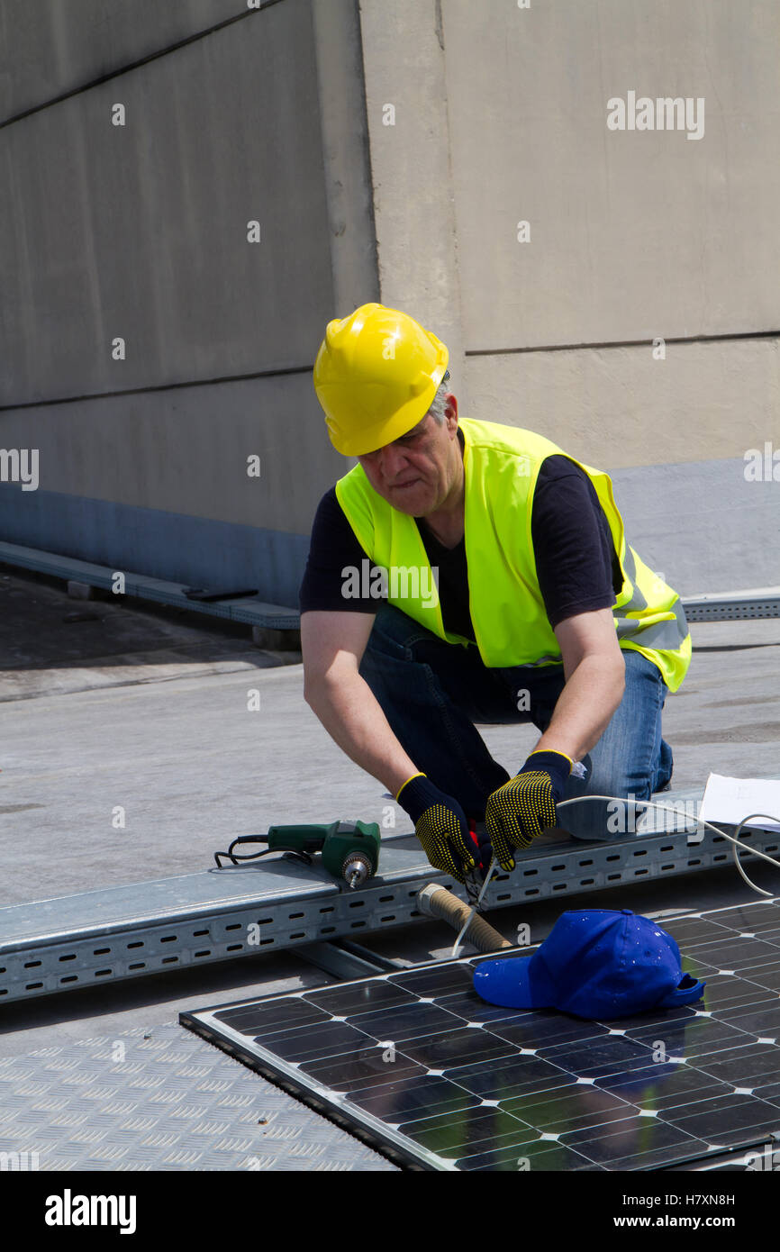 skilled worker working on a photovoltaic plant Stock Photo - Alamy