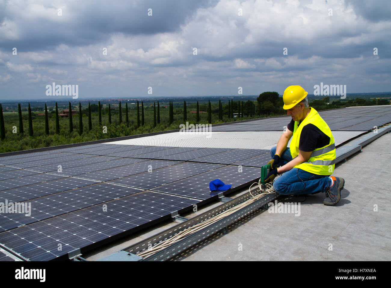 skilled worker working on a photovoltaic plant Stock Photo - Alamy