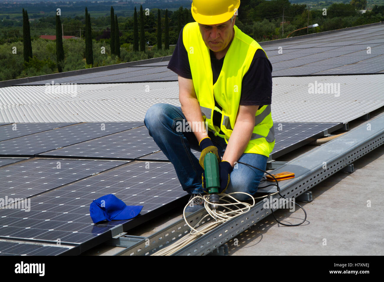 skilled worker working on a photovoltaic plant Stock Photo - Alamy