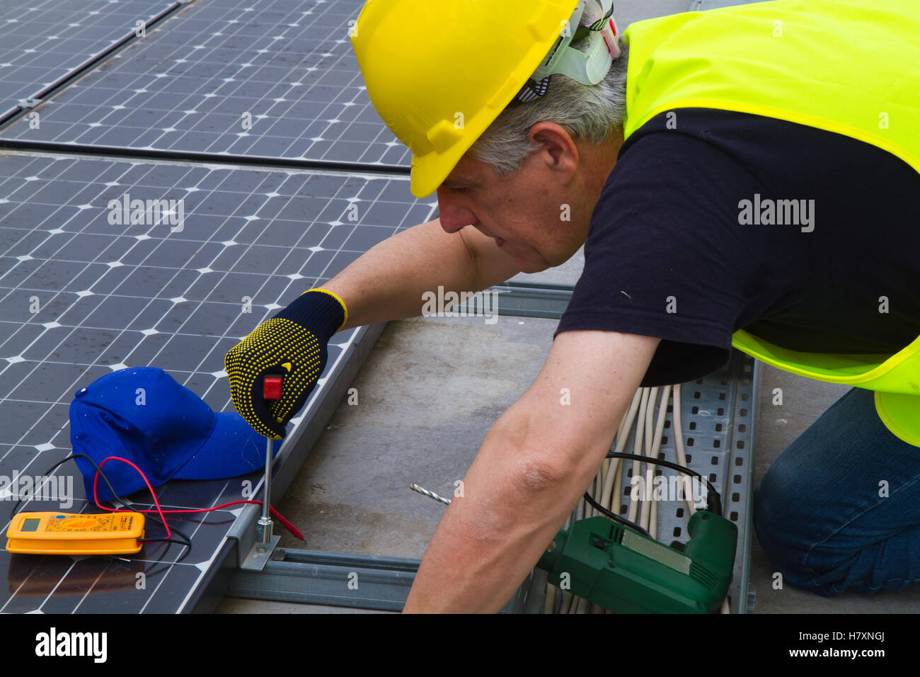 skilled worker working on a photovoltaic plant Stock Photo - Alamy