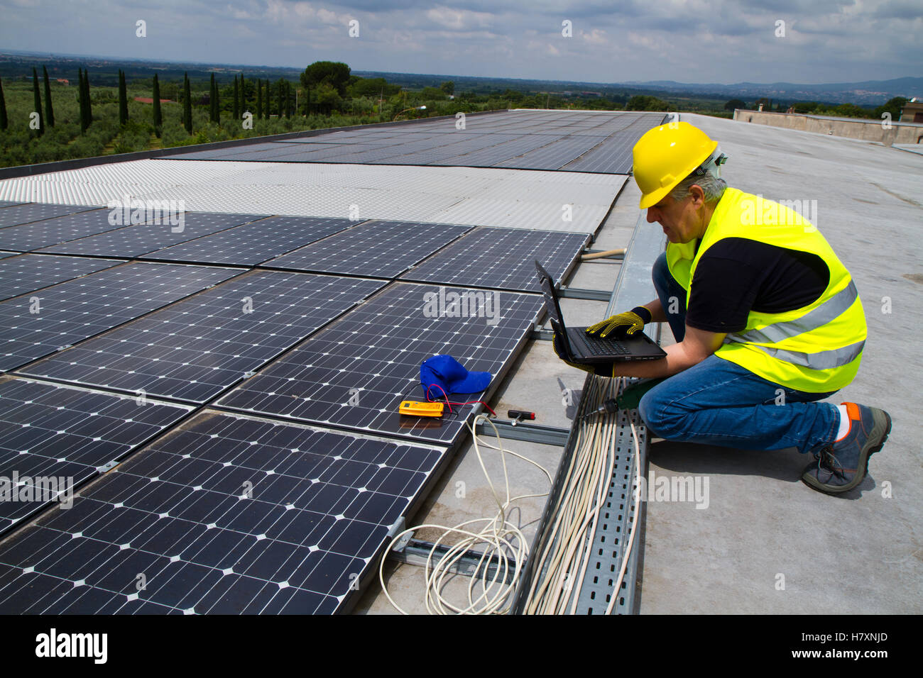 skilled worker working on a photovoltaic plant Stock Photo - Alamy