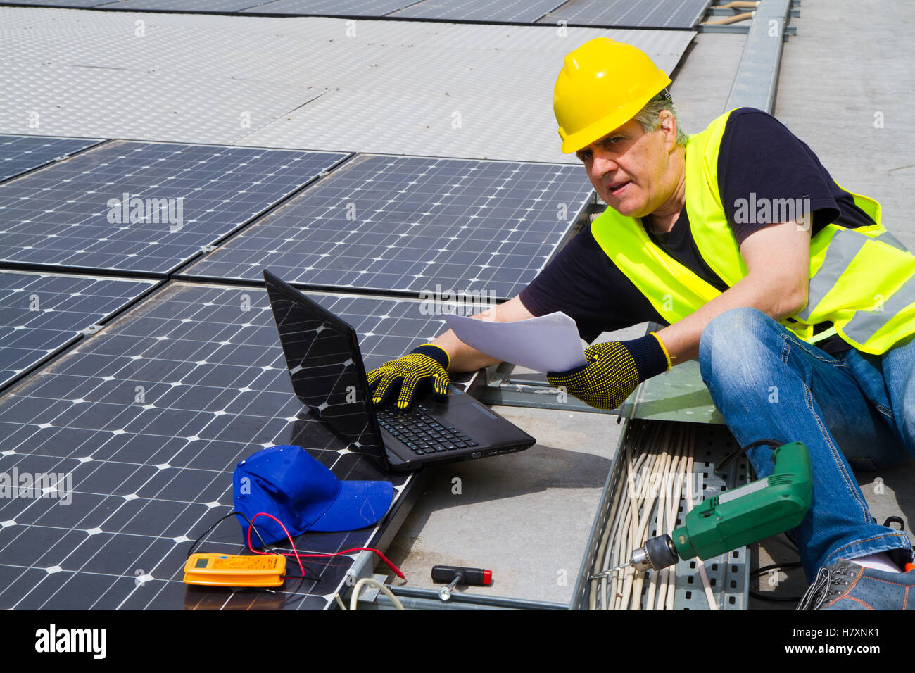skilled worker working on a photovoltaic plant Stock Photo - Alamy