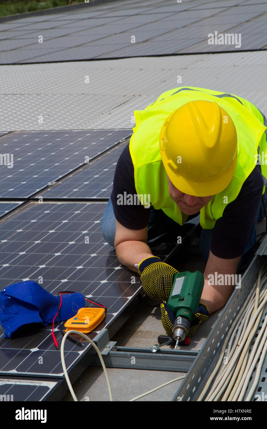 skilled worker working on a photovoltaic plant Stock Photo - Alamy