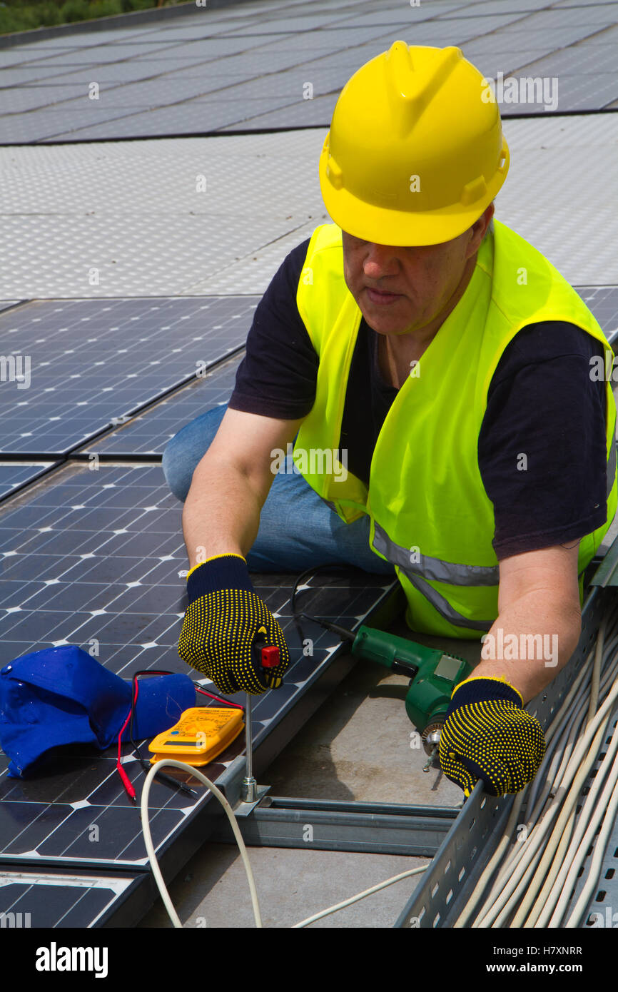 skilled worker working on a photovoltaic plant Stock Photo - Alamy