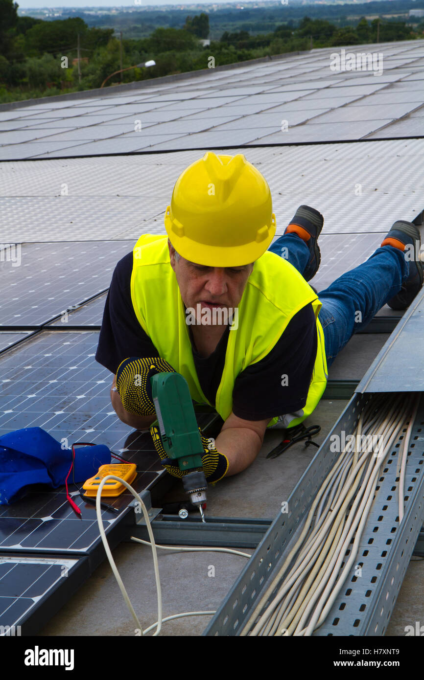 skilled worker working on a photovoltaic plant Stock Photo - Alamy