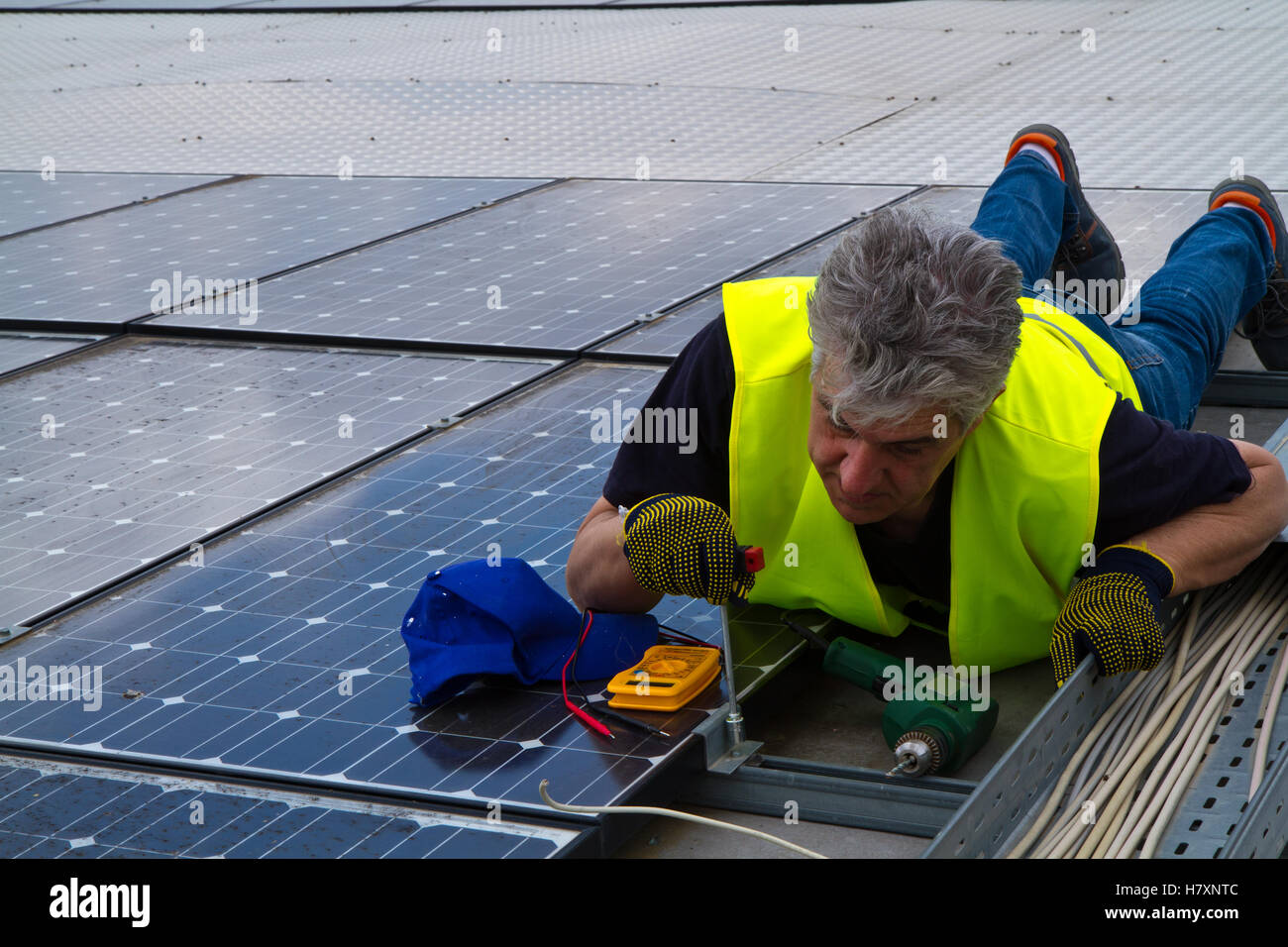 skilled worker working on a photovoltaic plant Stock Photo - Alamy