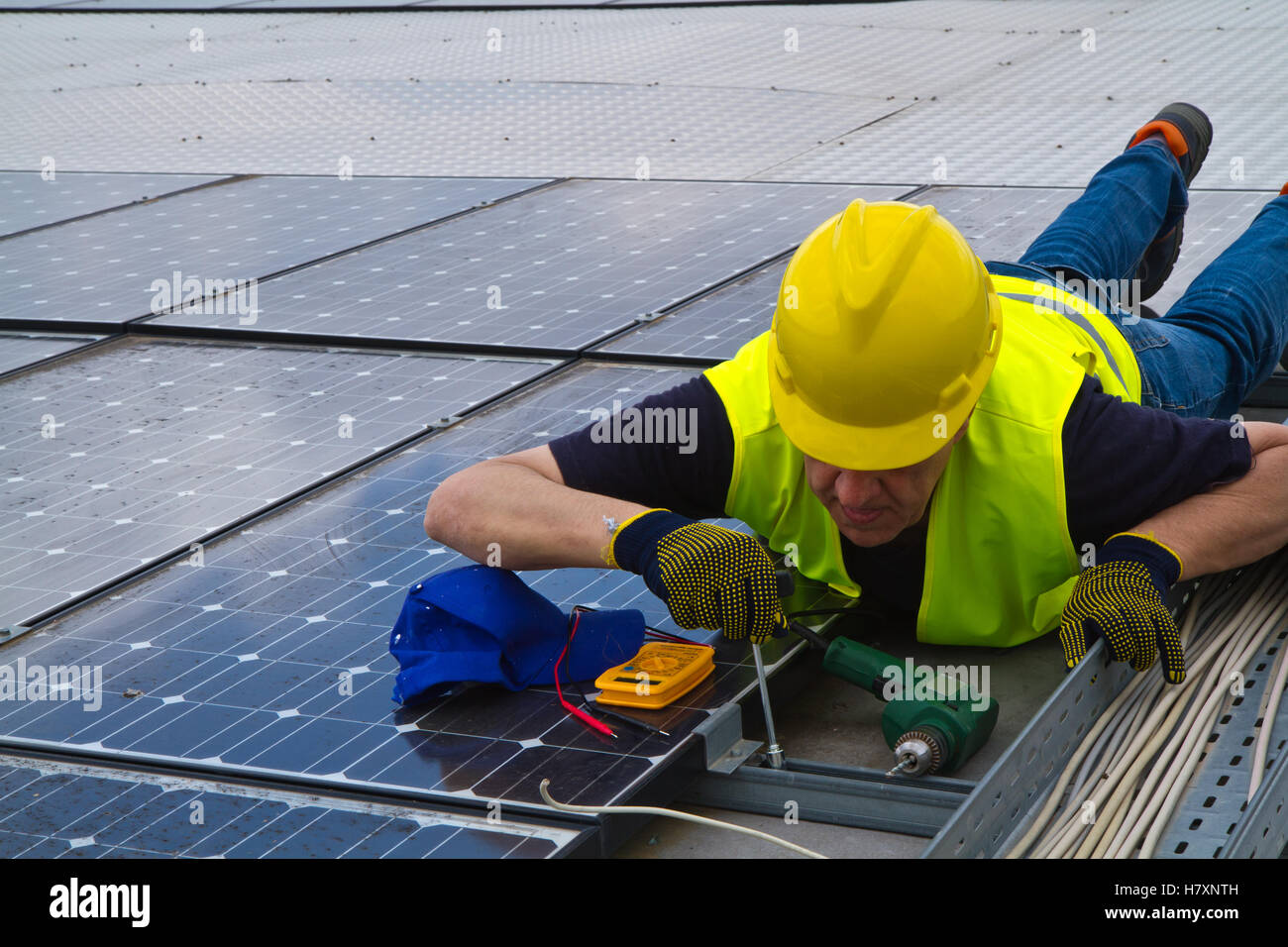 skilled worker working on a photovoltaic plant Stock Photo - Alamy