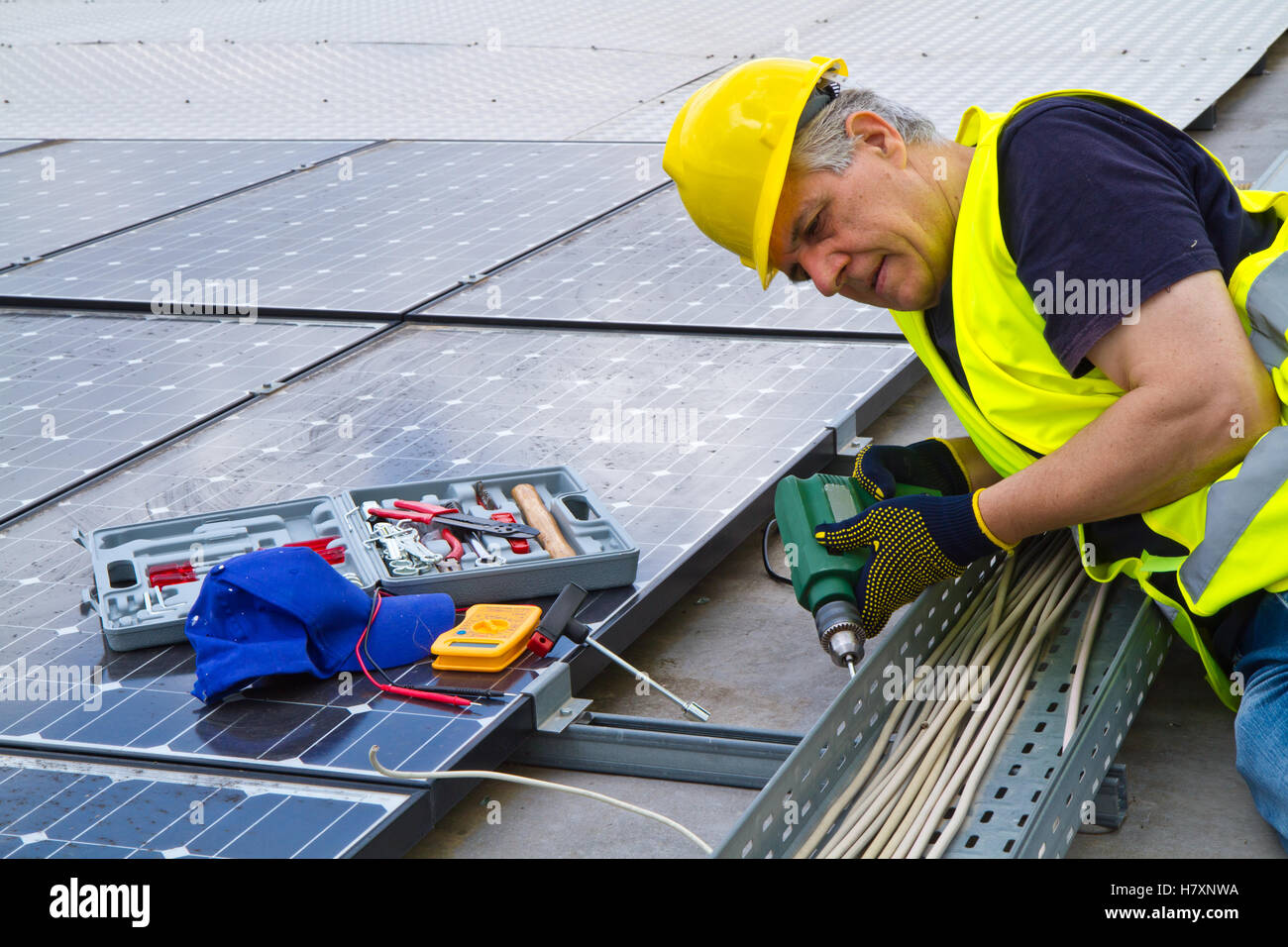 skilled worker working on a photovoltaic plant Stock Photo - Alamy